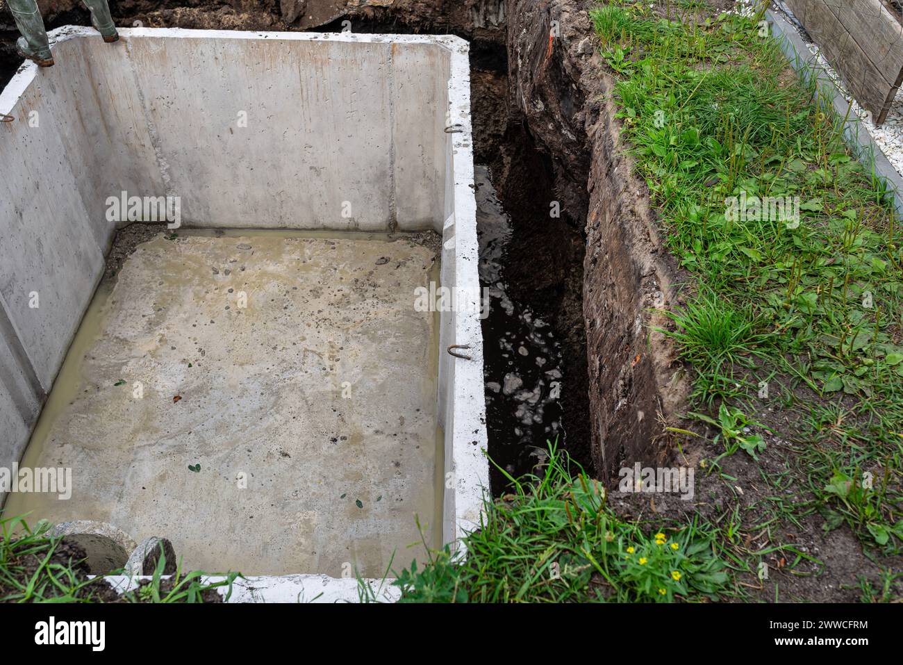 Concrete septic tank with a capacity of 10 m3 located in the garden ...