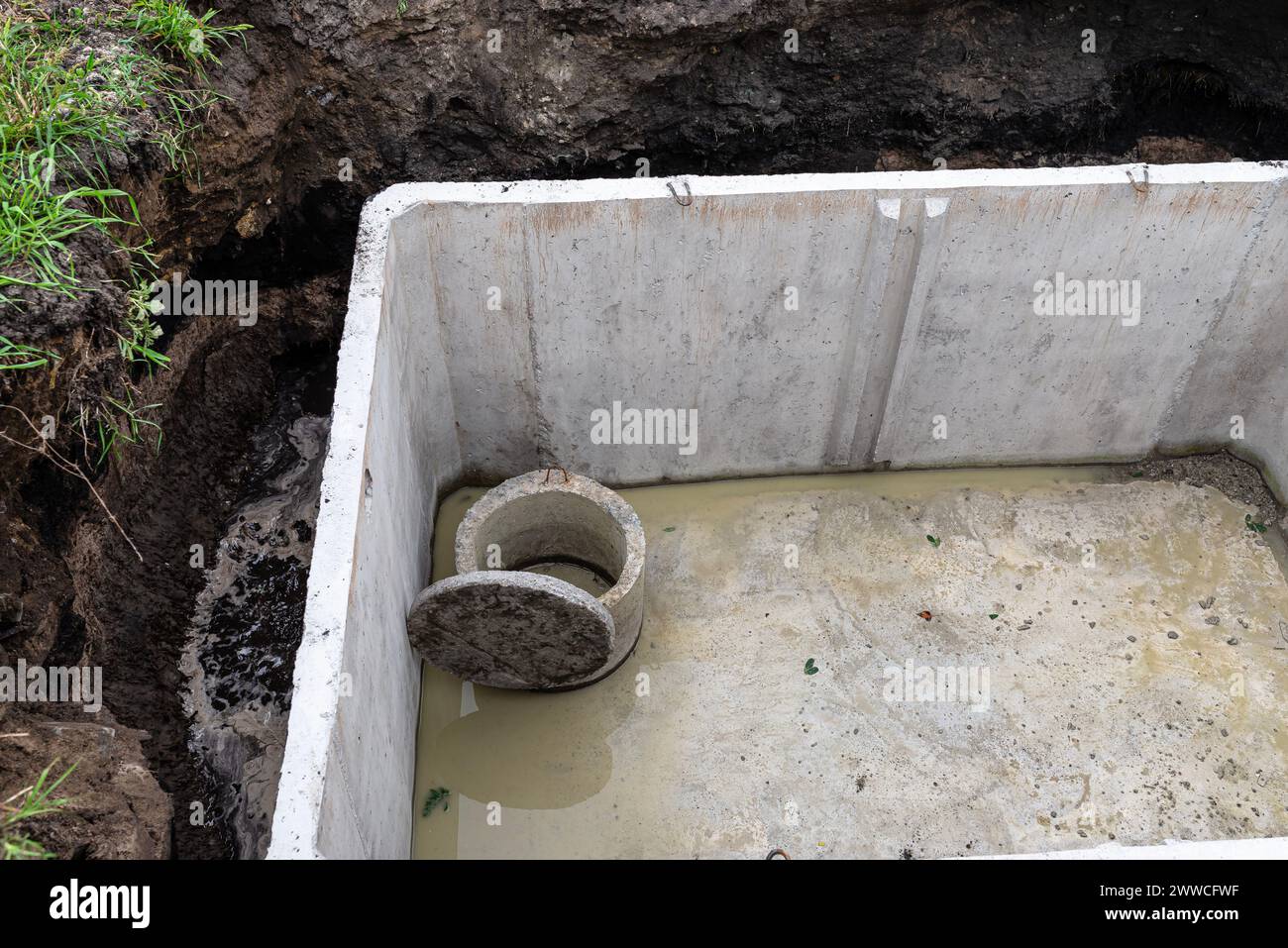 Concrete septic tank with a capacity of 10 m3 located in the garden ...