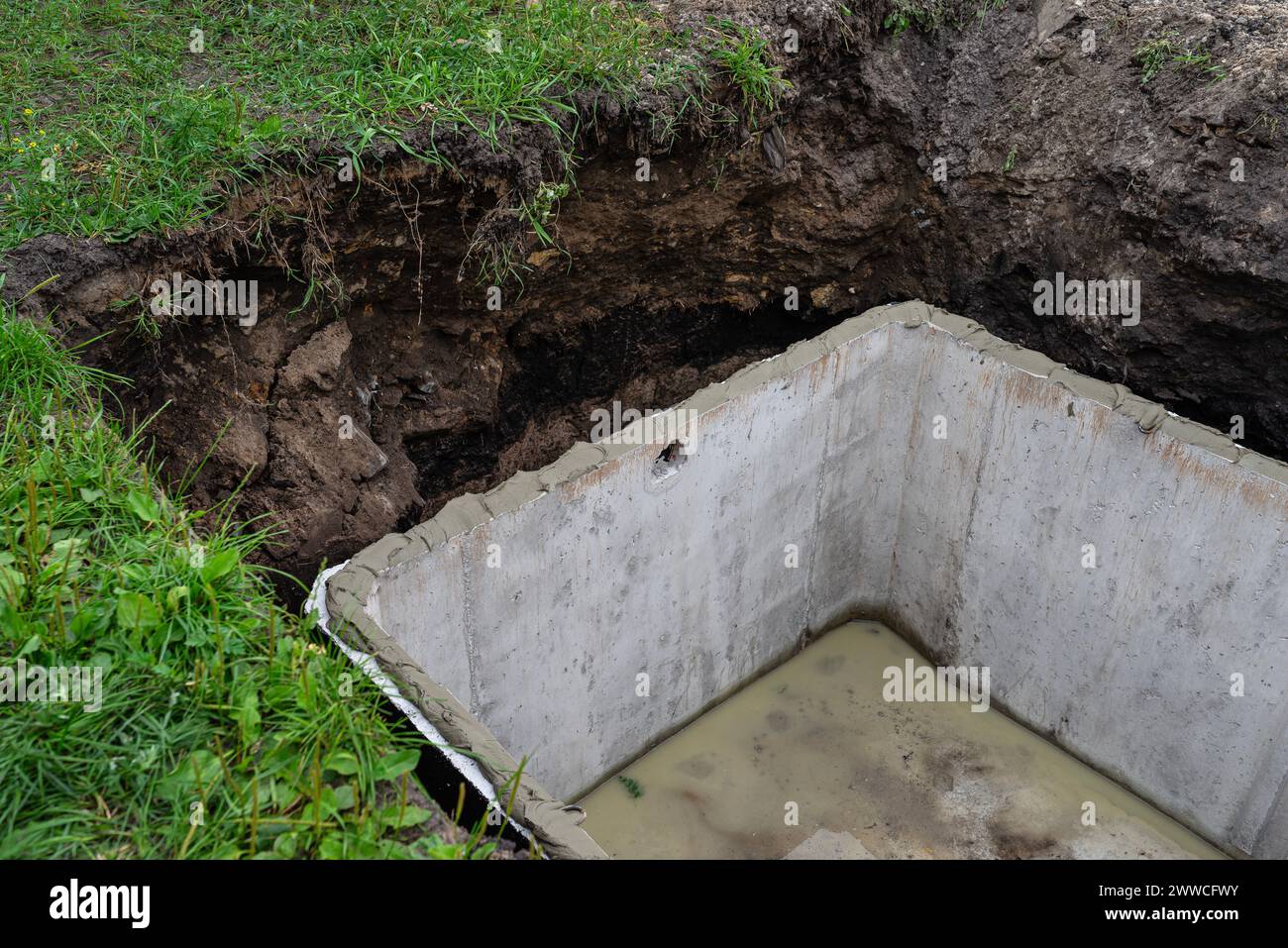Concrete septic tank with a capacity of 10 m3 located in the garden ...