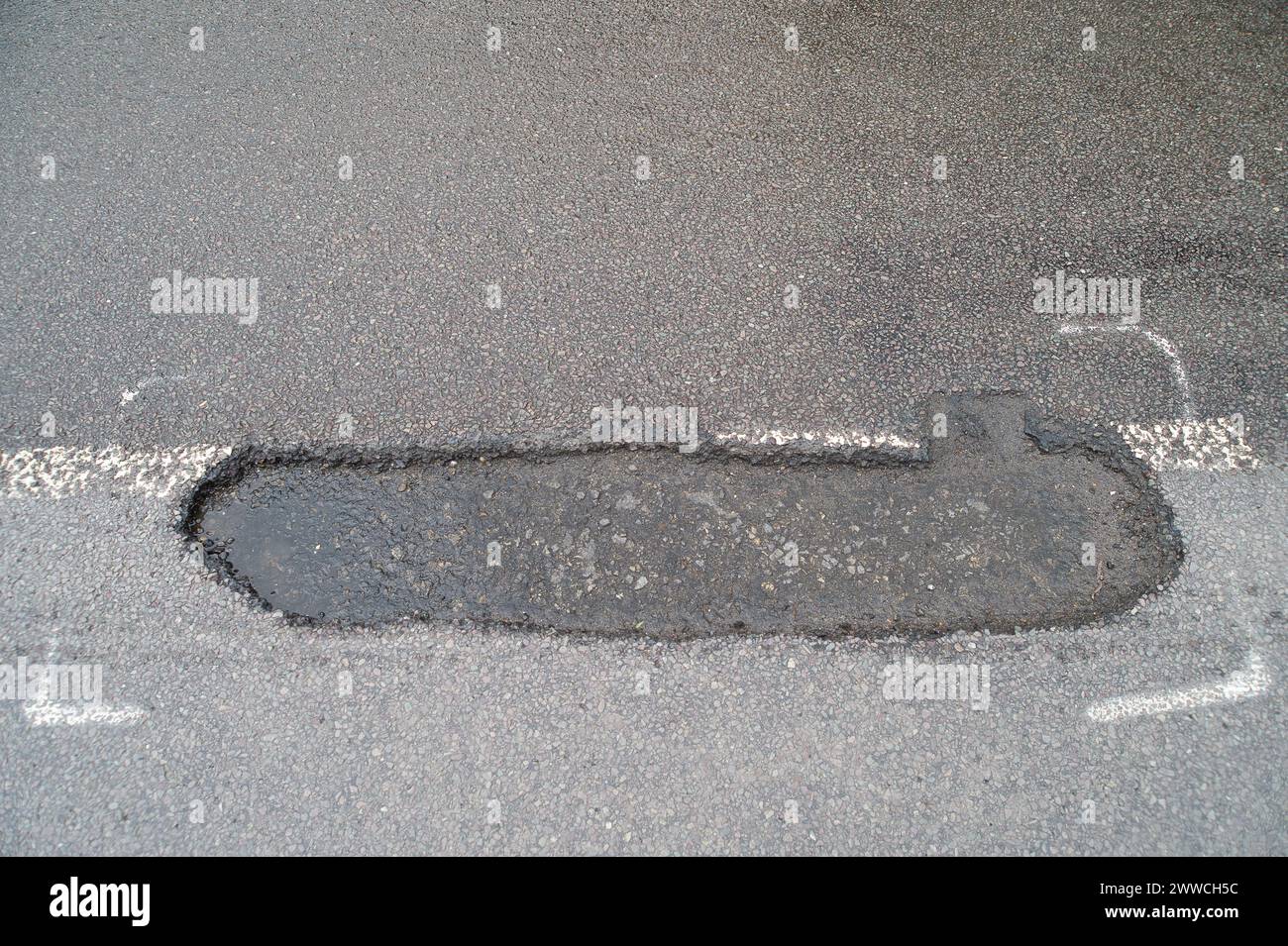 Slough, UK. 21st March, 2024. Water has been flowing out of a manhole ...