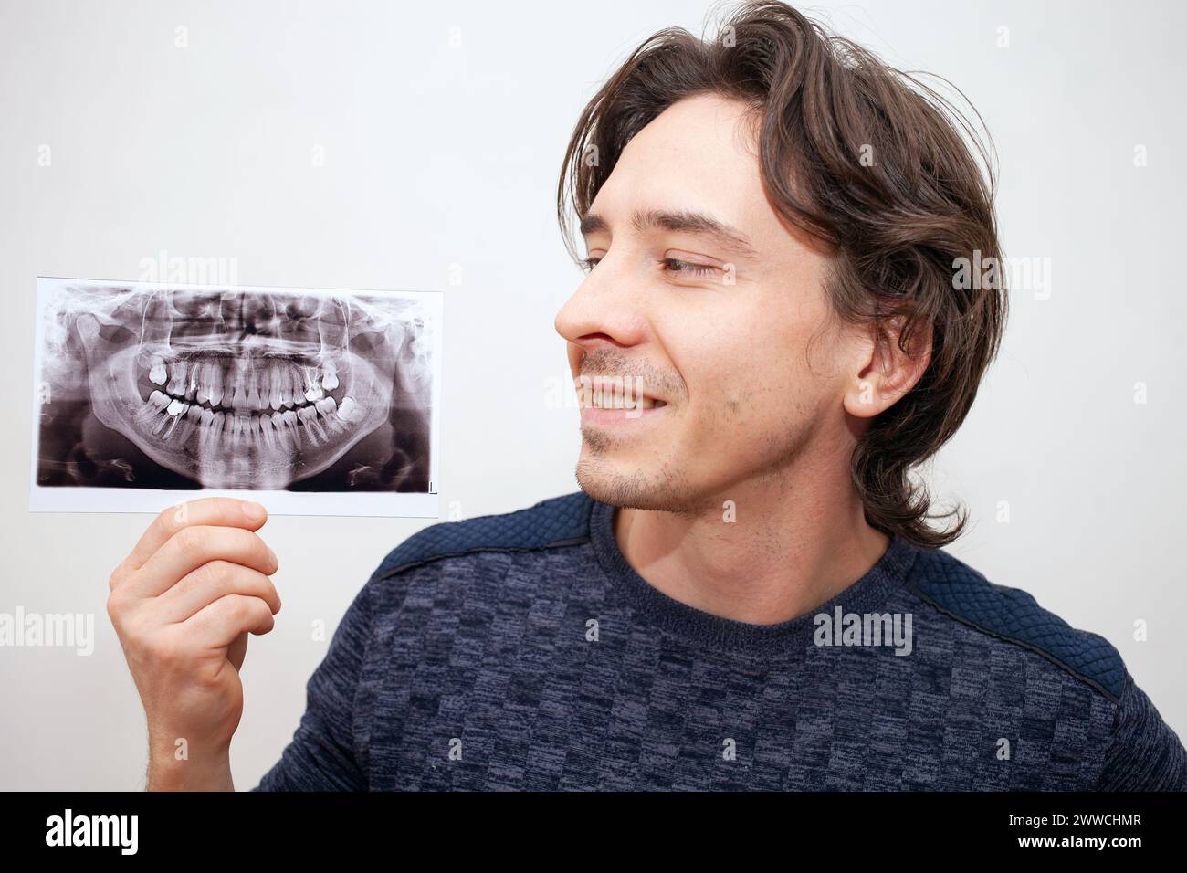 X-ray of teeth picture. The man smiles, opens his mouth. Poses ...