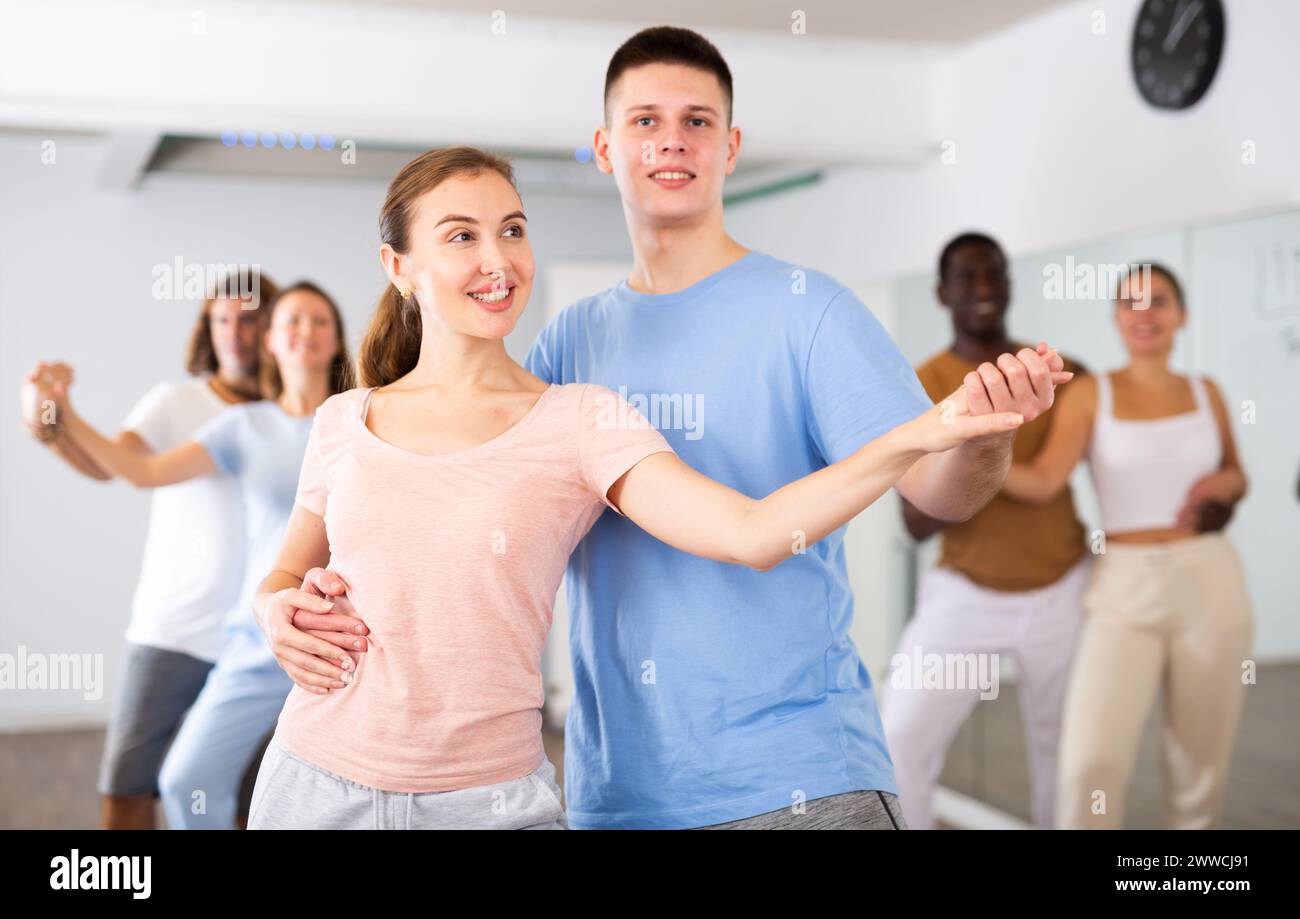 Diverse couple dancing together hi-res stock photography and images - Alamy