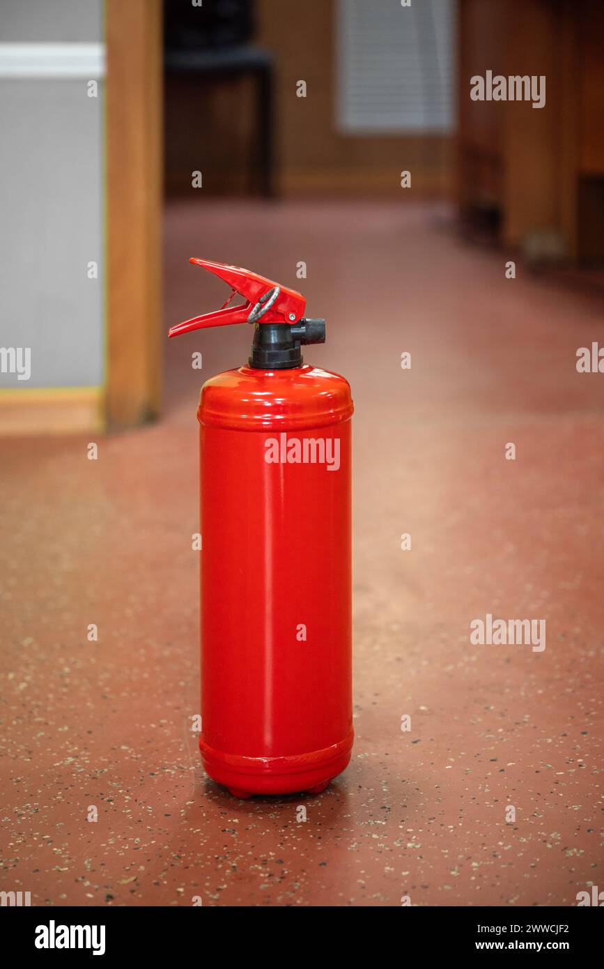 Fire extinguisher in workplace office Stock Photo - Alamy