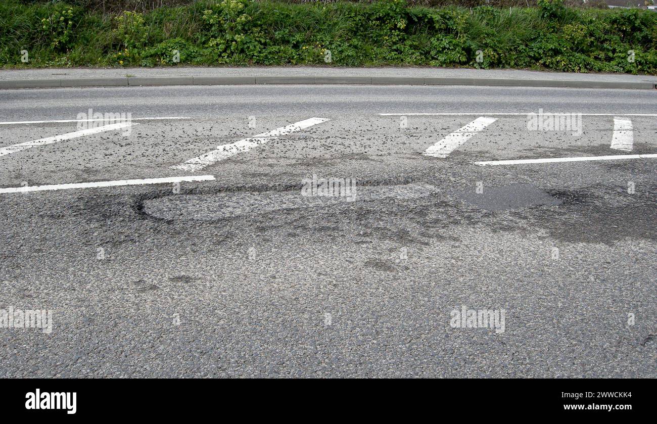 Road pot hole on a busy main road Stock Photo - Alamy