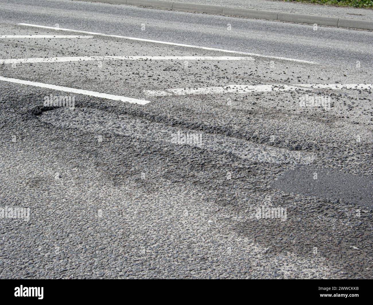 Large pot hole in a main road Stock Photo - Alamy