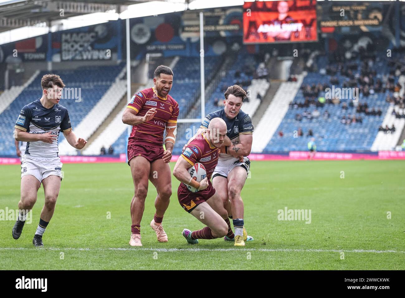 Adam Swift of Huddersfield Giants goes over for his fourth try to make ...