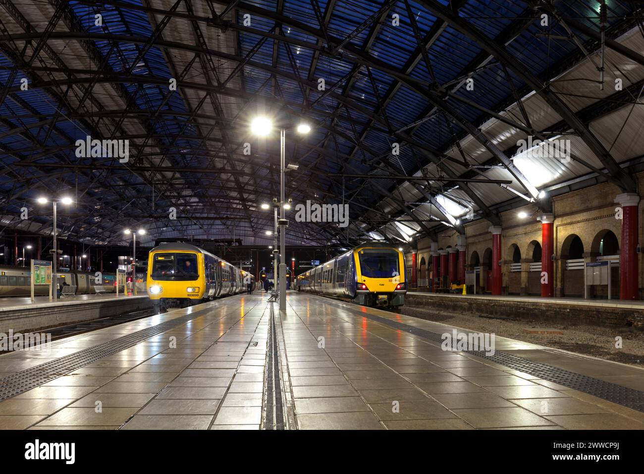 Northern Rail class 331 (right) and class 323 (Left) electric multiple unit train under the roof ...