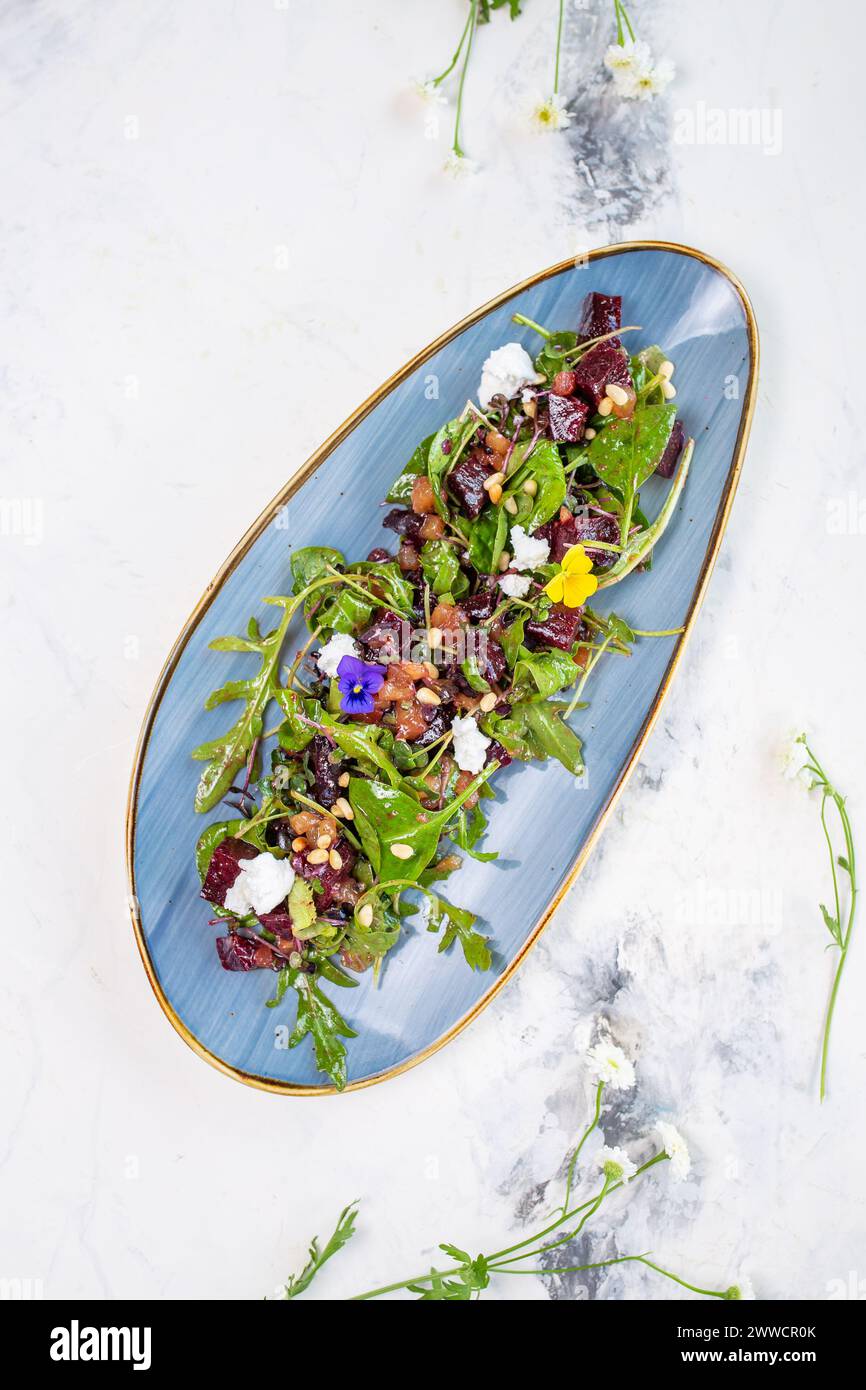 Wholesome and colorful salad of organic baby greens, roasted beets ...