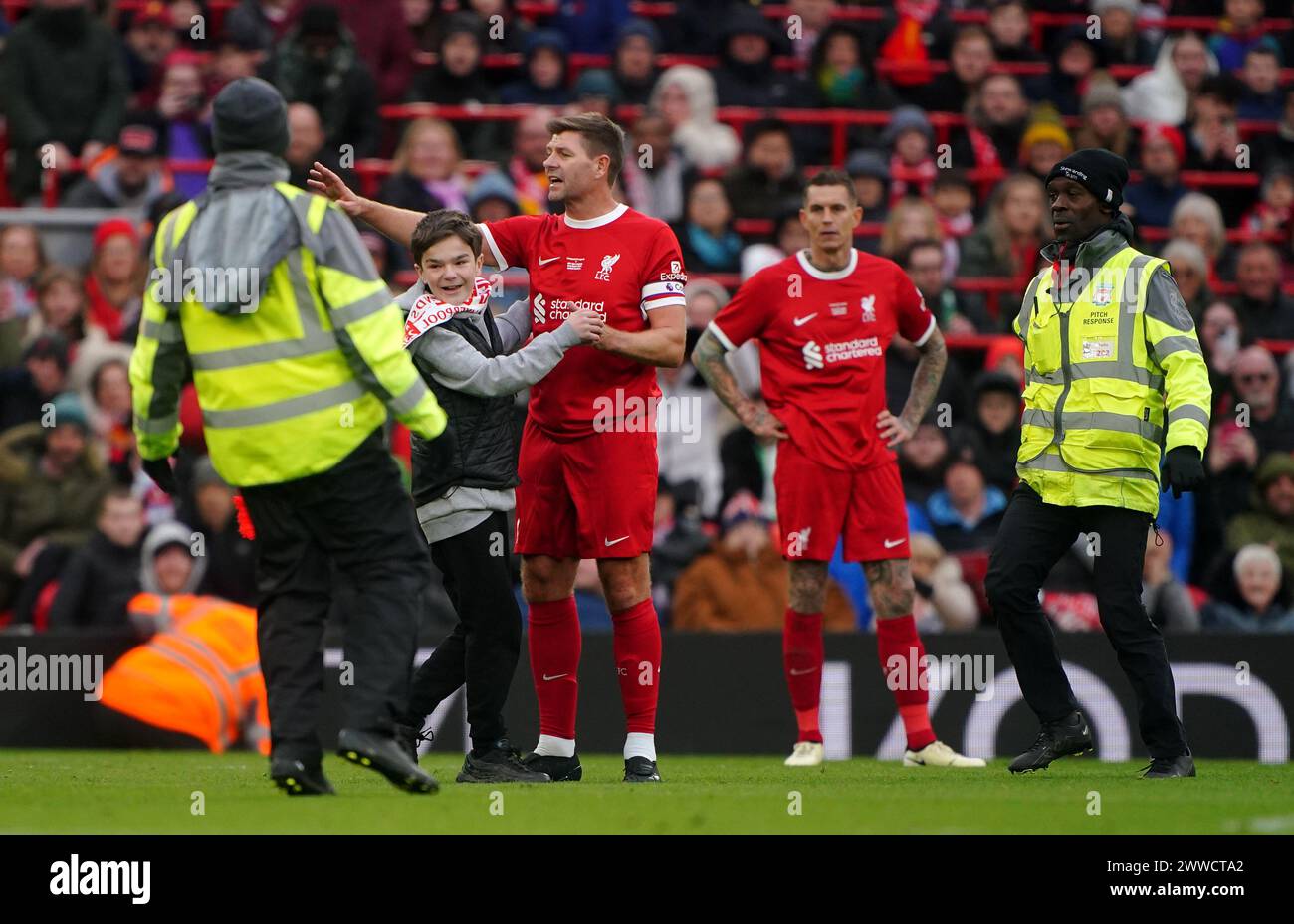 A pitch invader with Liverpool Legends' Steven Gerrard during the LFC ...