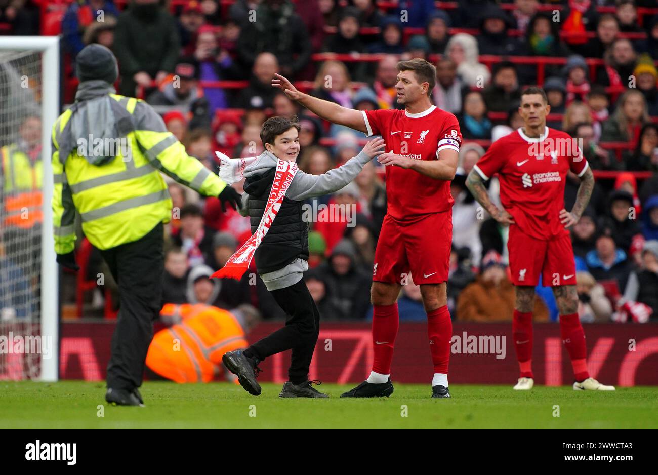 A pitch invader with Liverpool Legends' Steven Gerrard during the LFC ...