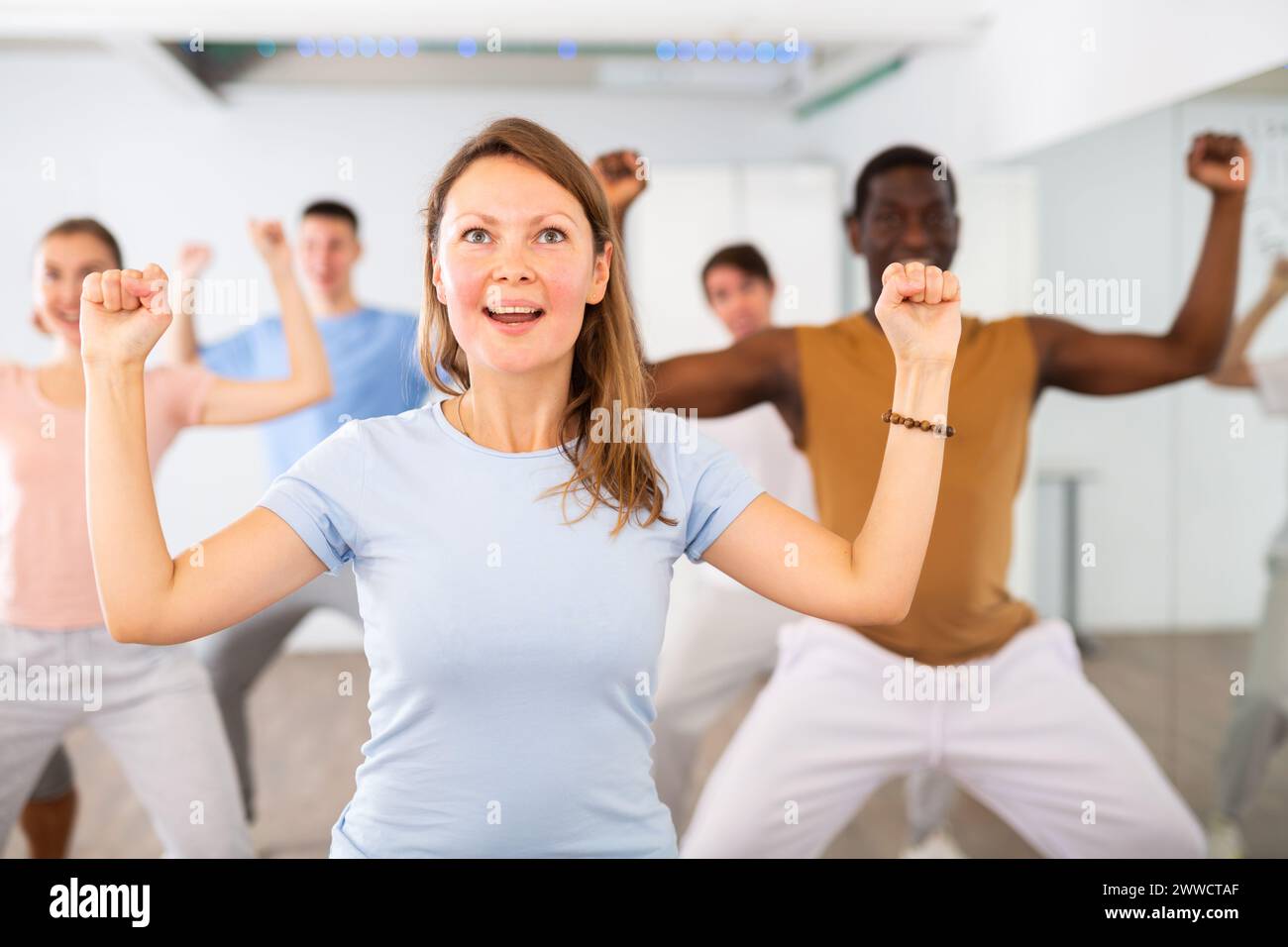Group dancers performing dynamic movements hi-res stock photography and ...