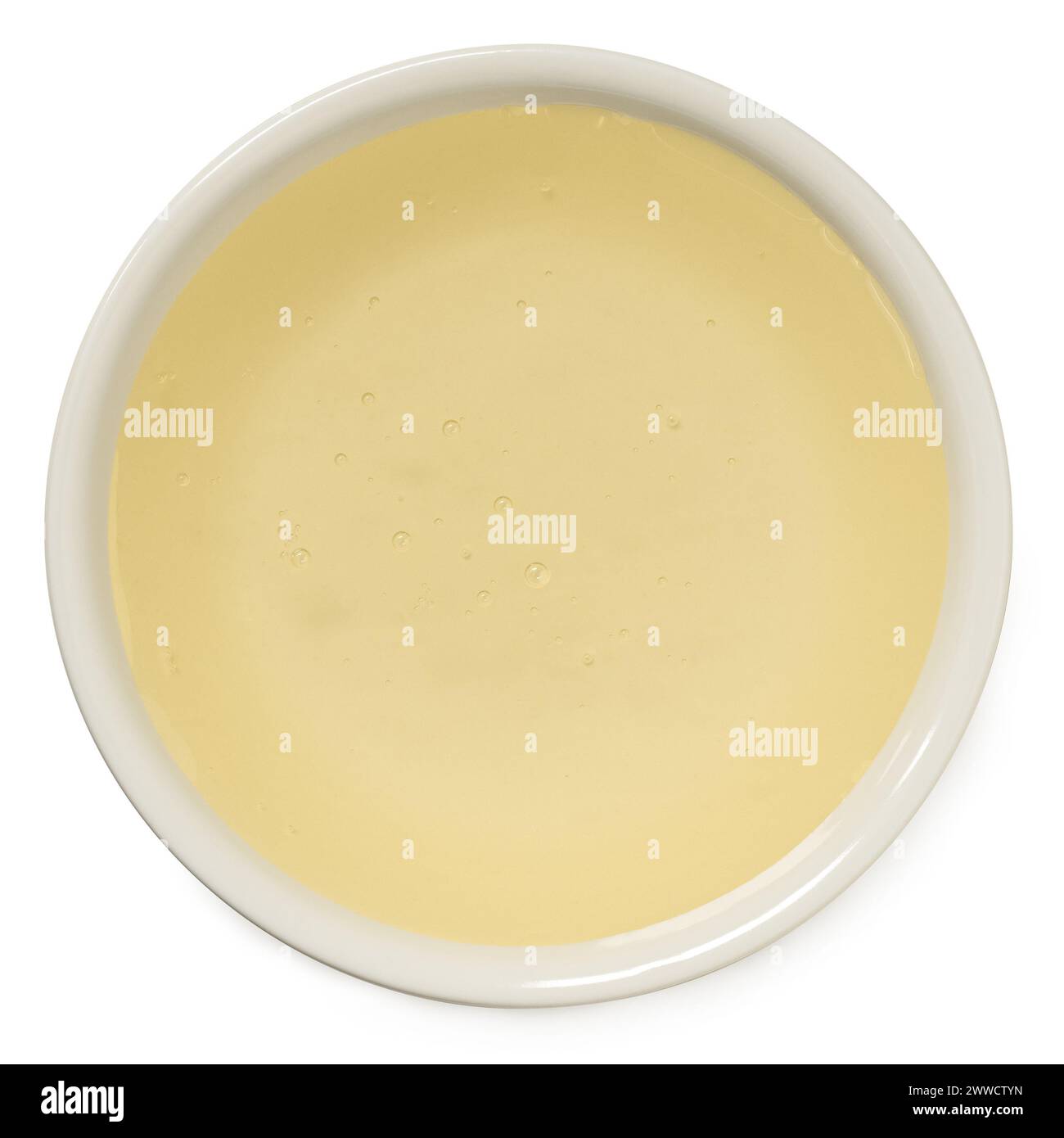 Rice syrup in a white ceramic bowl isolated on white. Top view Stock ...
