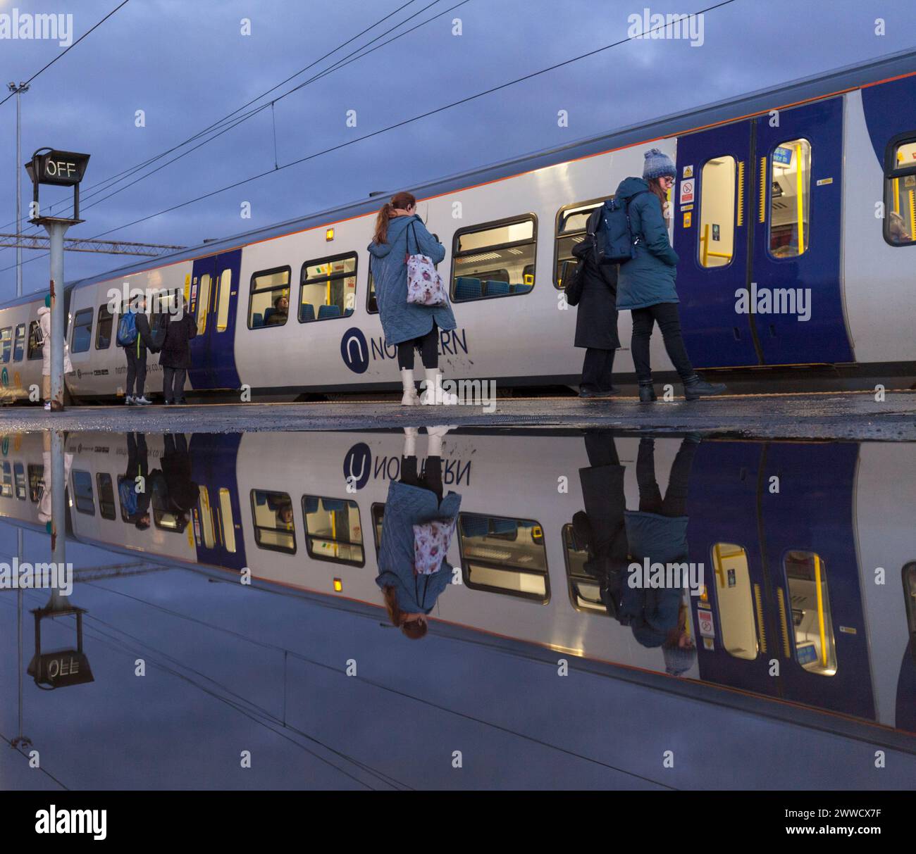 Rail commuters / rail passengers boarding a Northern Rail train at Edge ...