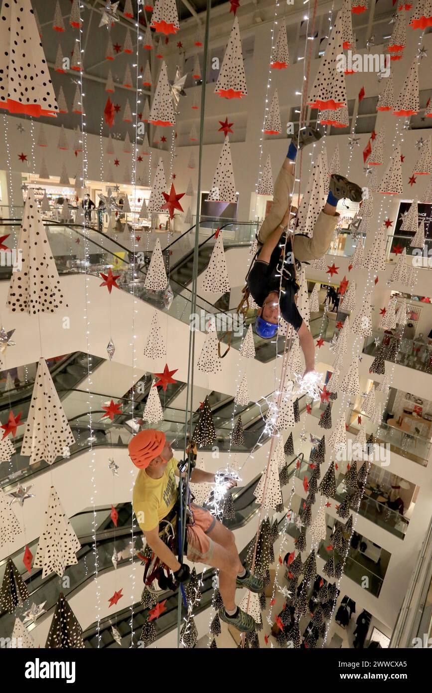 06/010/13 Hanging high above the store's atrium, rope access ...