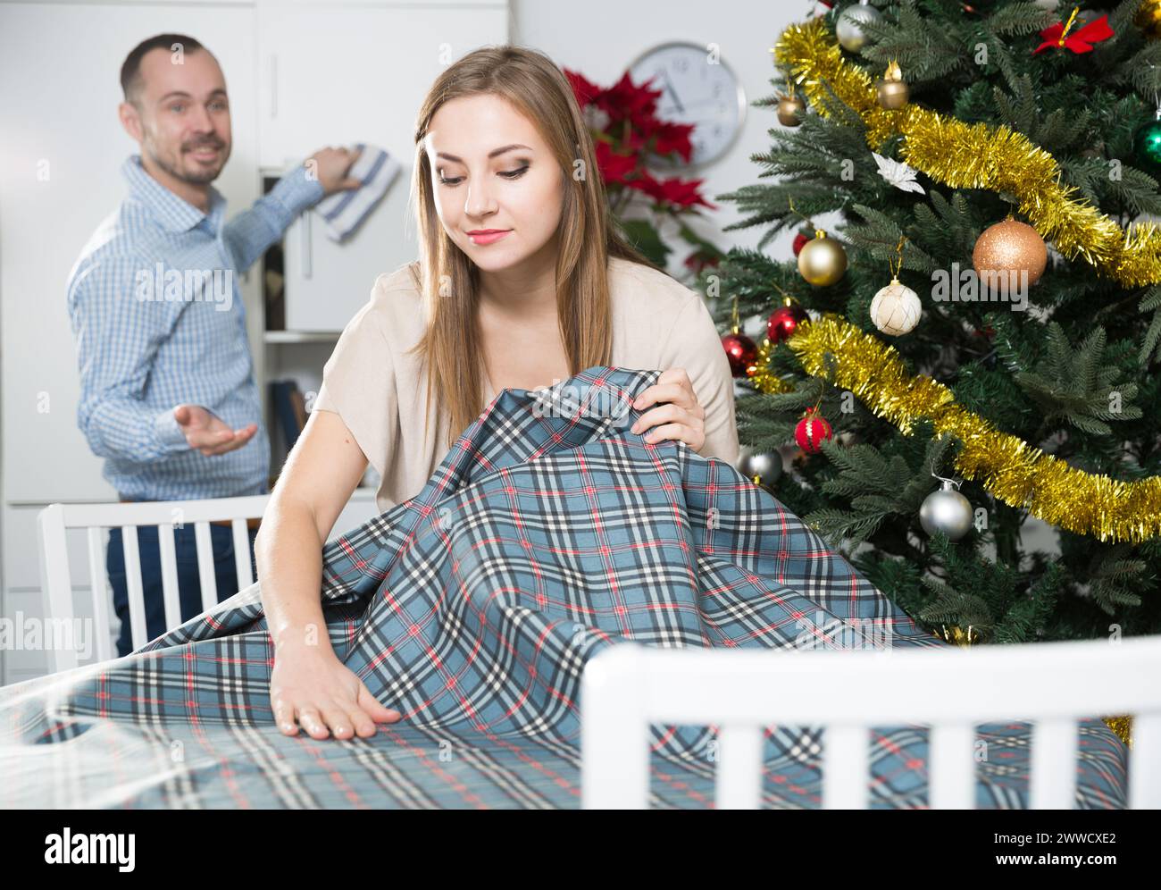 Woman spreading tablecloth hi-res stock photography and images - Alamy