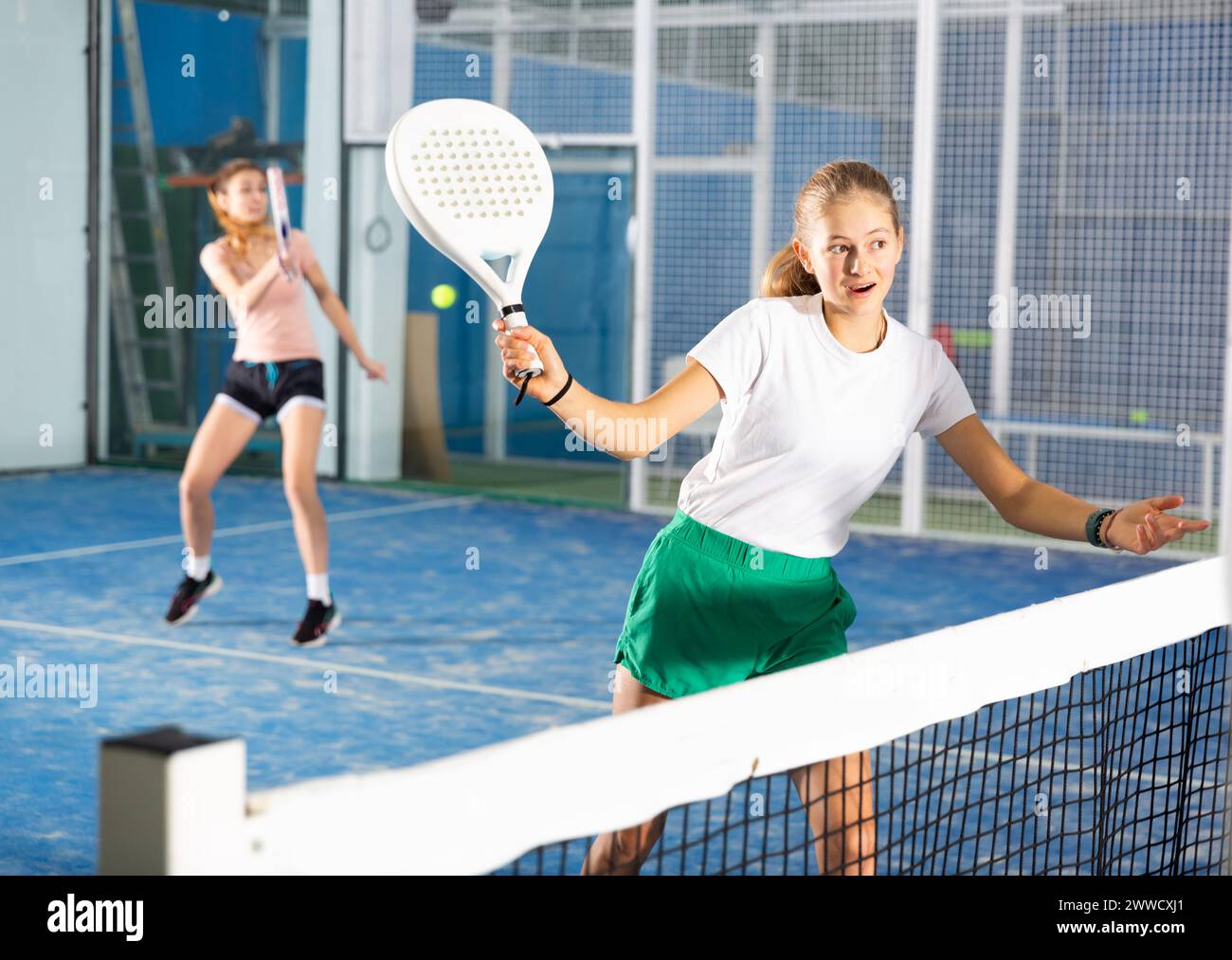 Padel tennis teenage girl in court ready for play Stock Photo - Alamy