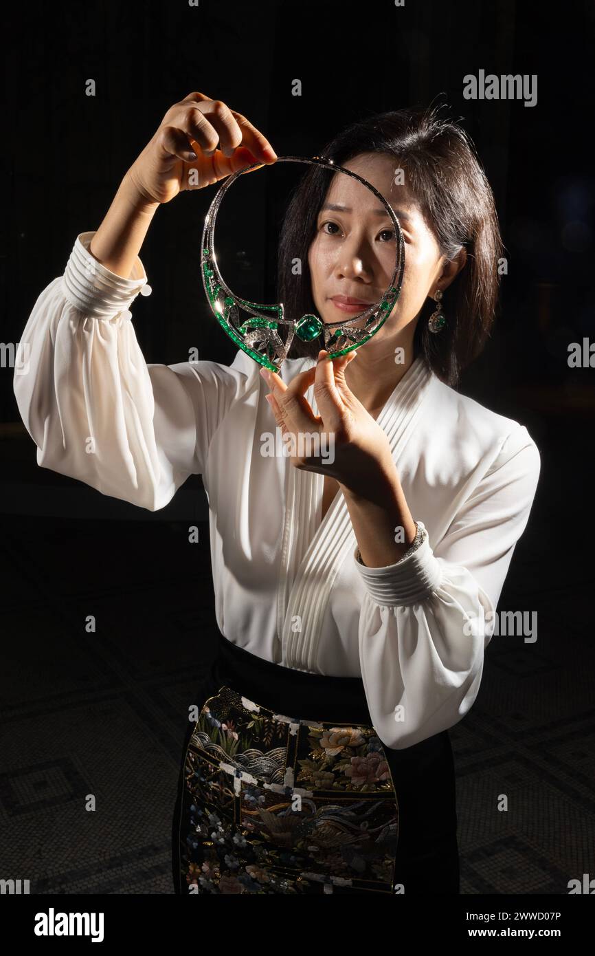 22/03/24 Charlene Li, 40, inspects the emerald and diamond centrepiece ...