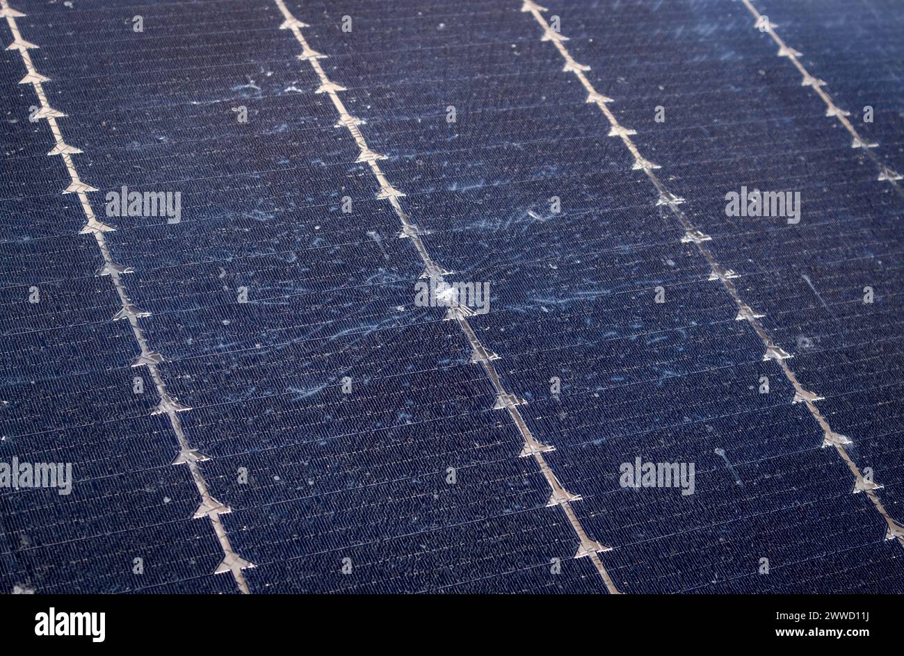 Close up view of damaged broken solar panel tempered glass cell. Stone ...