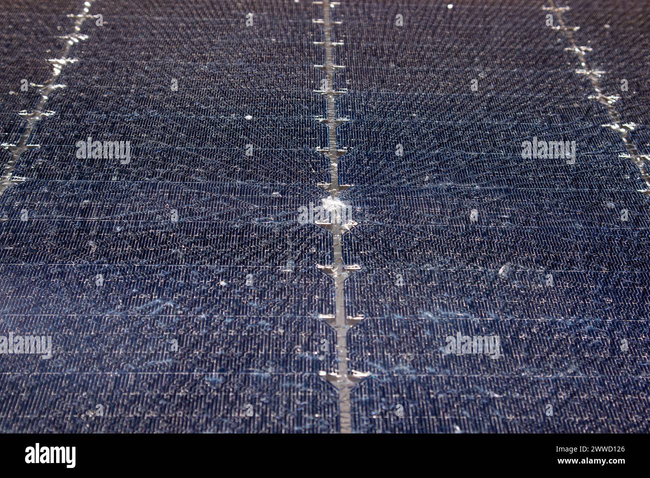 Close up view of damaged broken solar panel tempered glass cell. Stone ...