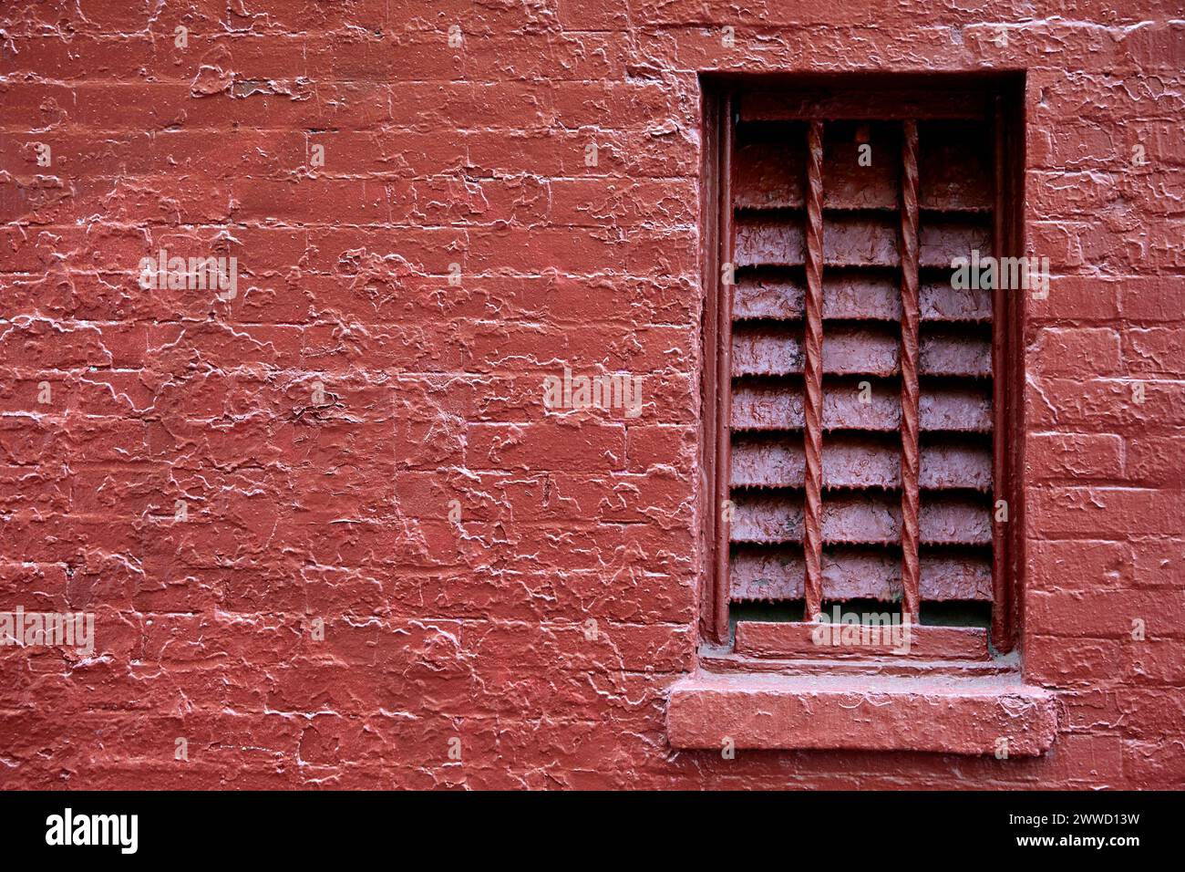 Vented Opening in a Painted Red Brick Wall Stock Photo - Alamy