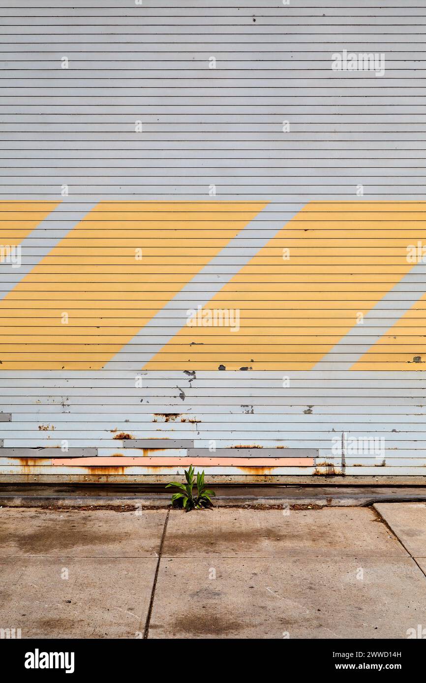 Vertical View of Closed Grey Garage Door with Yellow Diagonal Stripes ...