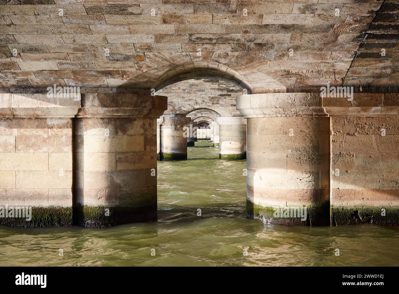 River Passage Under a Stone Bridge in Paris Stock Photo - Alamy