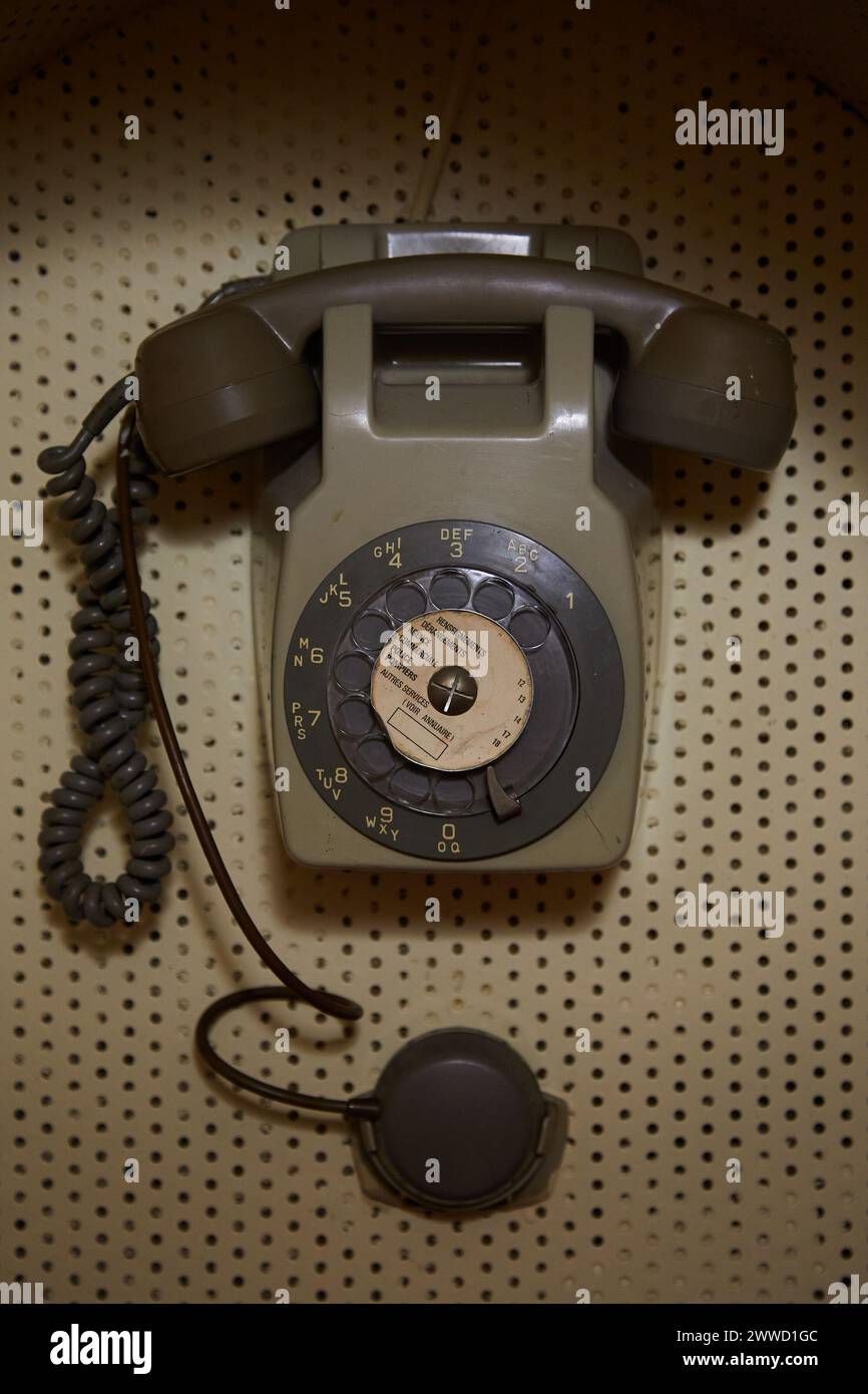 Old Brown Telephone on Peg Board Wall Stock Photo - Alamy