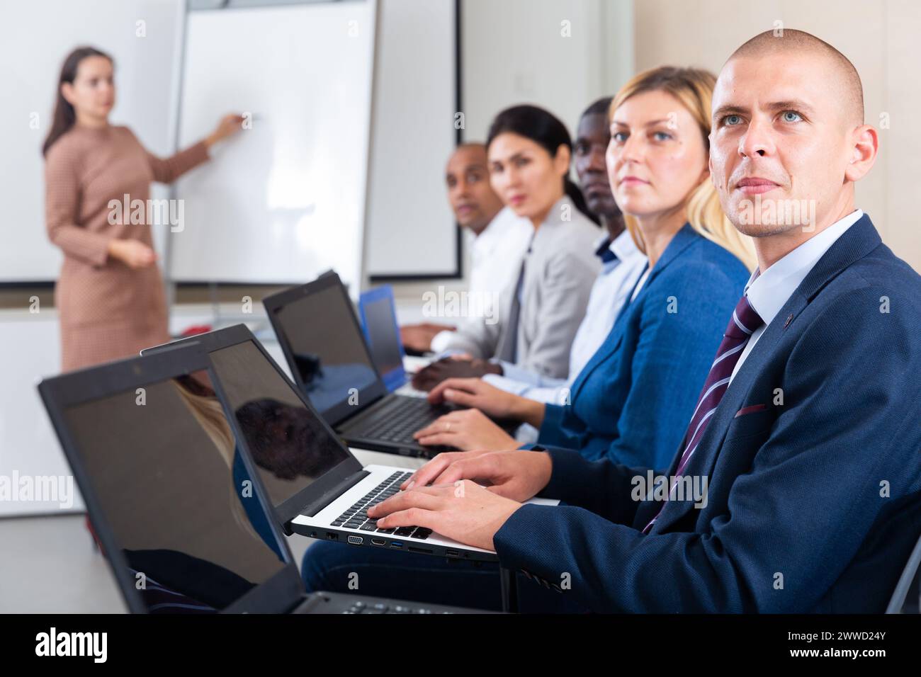 international group of businessmen with computer at world training ...