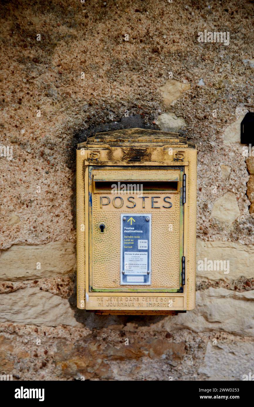 Yellow Mailbox Set in Stone Wall Stock Photo - Alamy