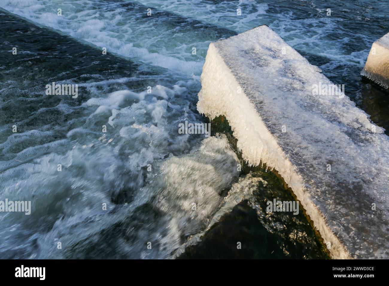 Water Cascading over Weir Step in river canal Stock Photo - Alamy