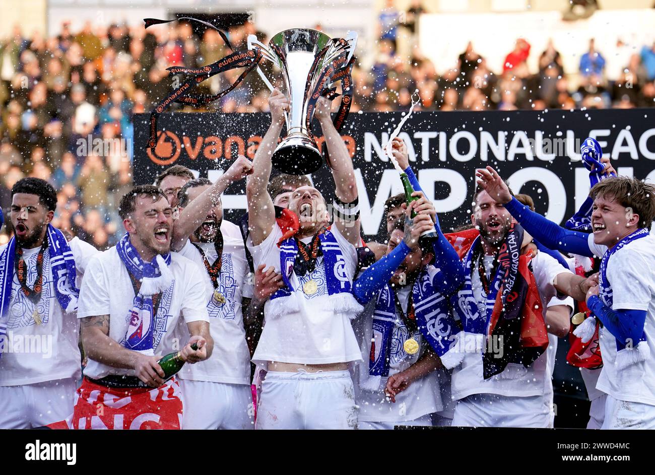 Chesterfield’s Jamie Grimes (with trophy) celebrates their promotion ...