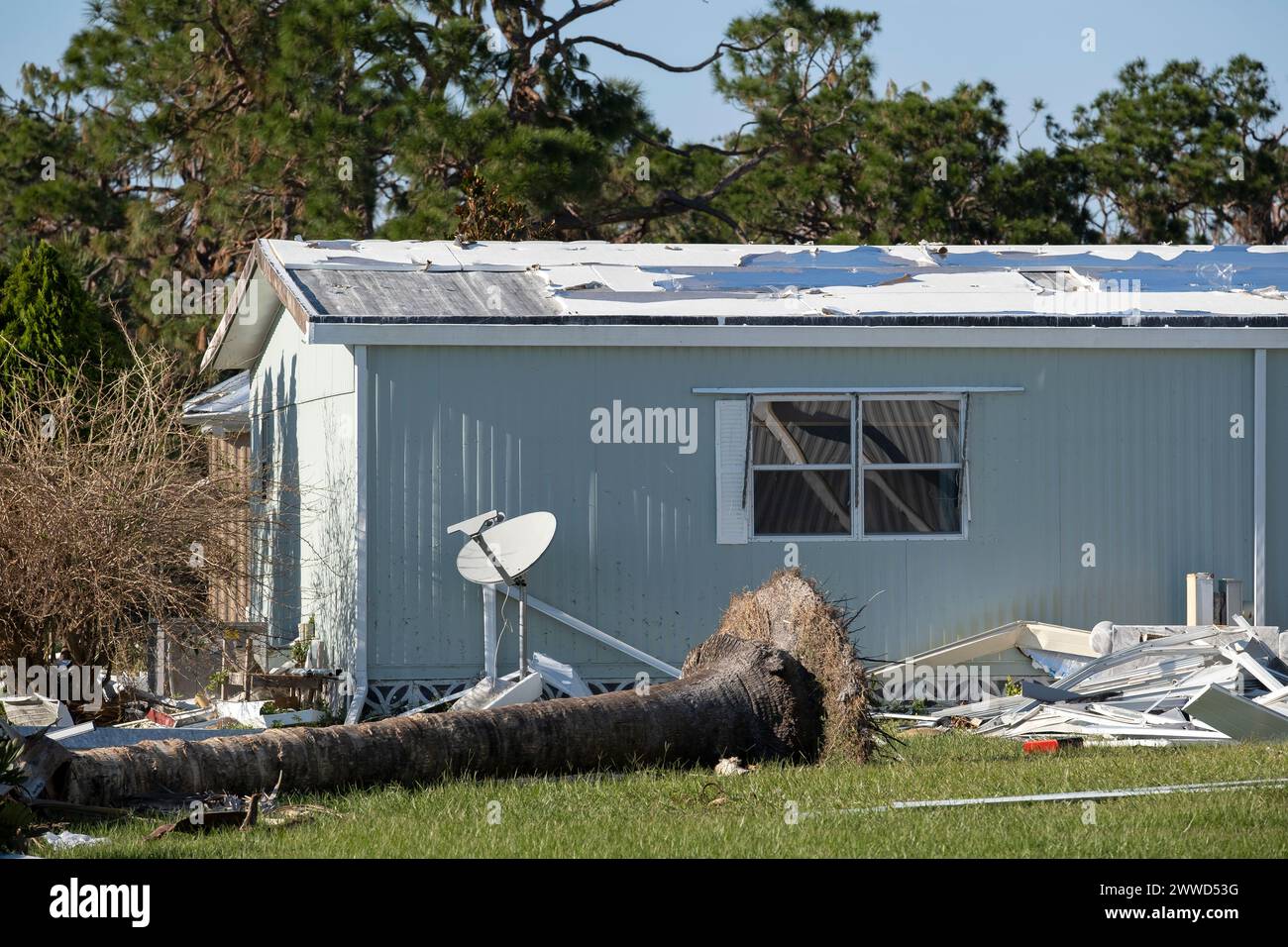 Severely damaged houses after hurricane in Florida mobile home ...