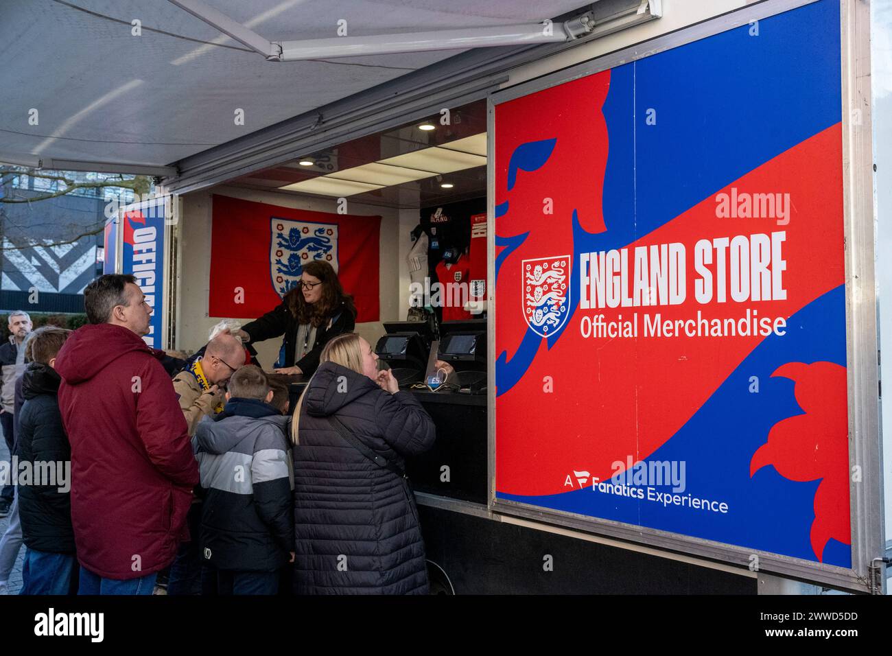 London, UK. 23 March 2024. A stall selling official merchandise as ...