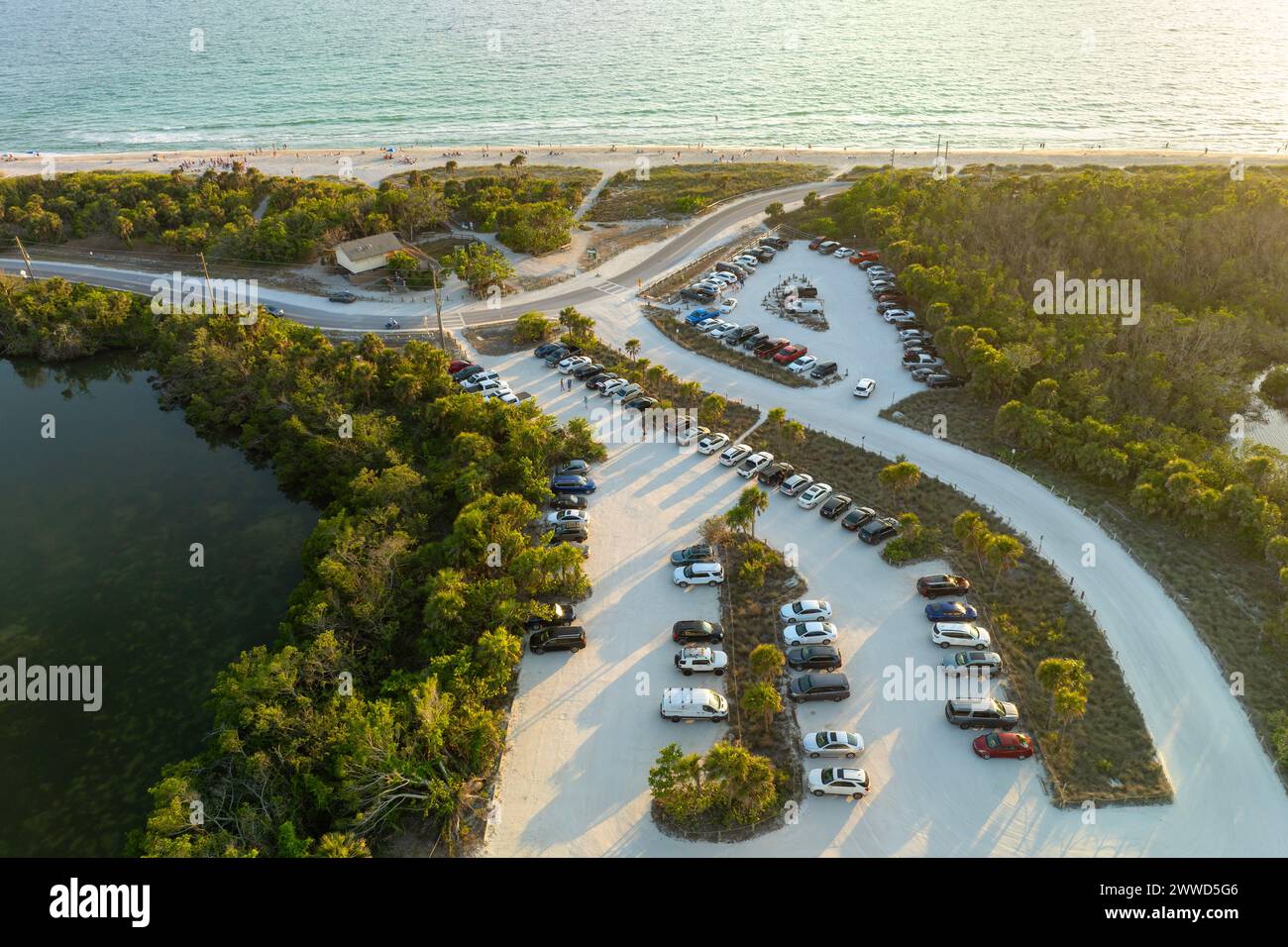 Vehicle parking area with cars parked on ocean beach parking lot at ...