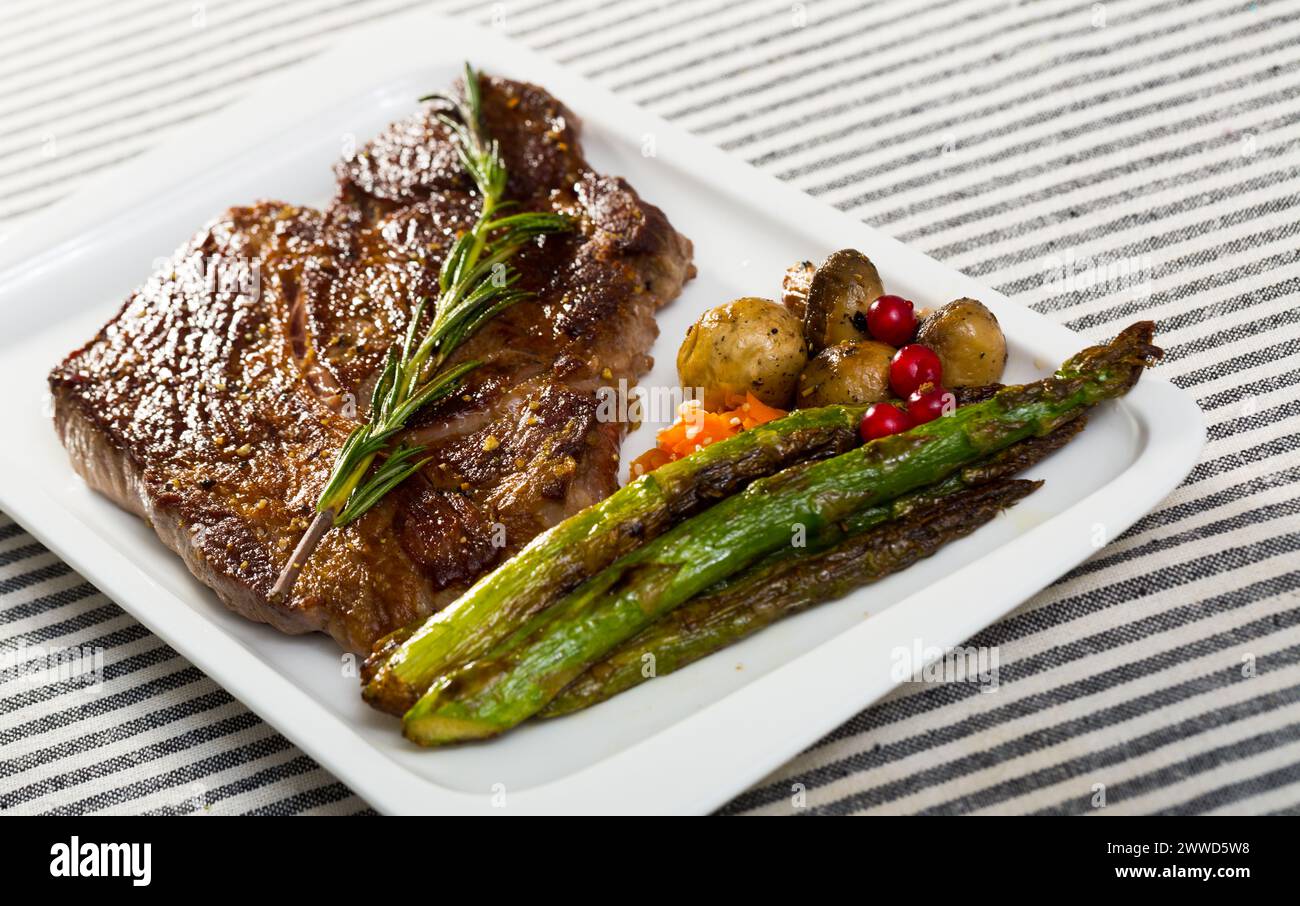 Image of beef entrecote with mushroom and asparagus Stock Photo - Alamy