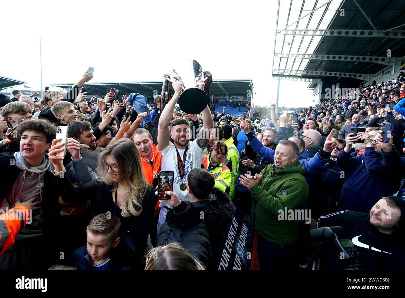 Chesterfield players celebrate their promotion with the fans on the ...