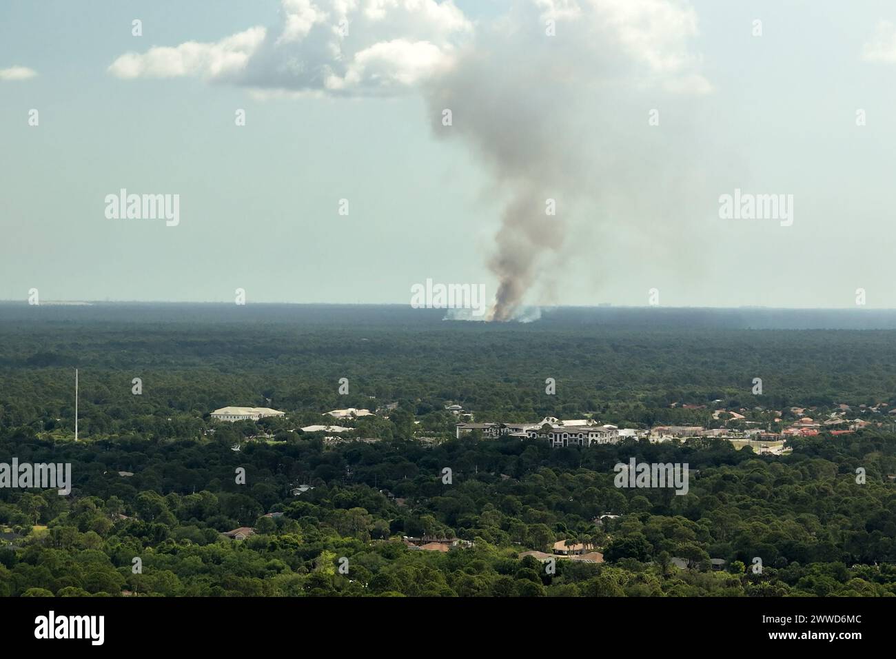 Aerial view of large wildfire burning severely in Florida jungle woods ...