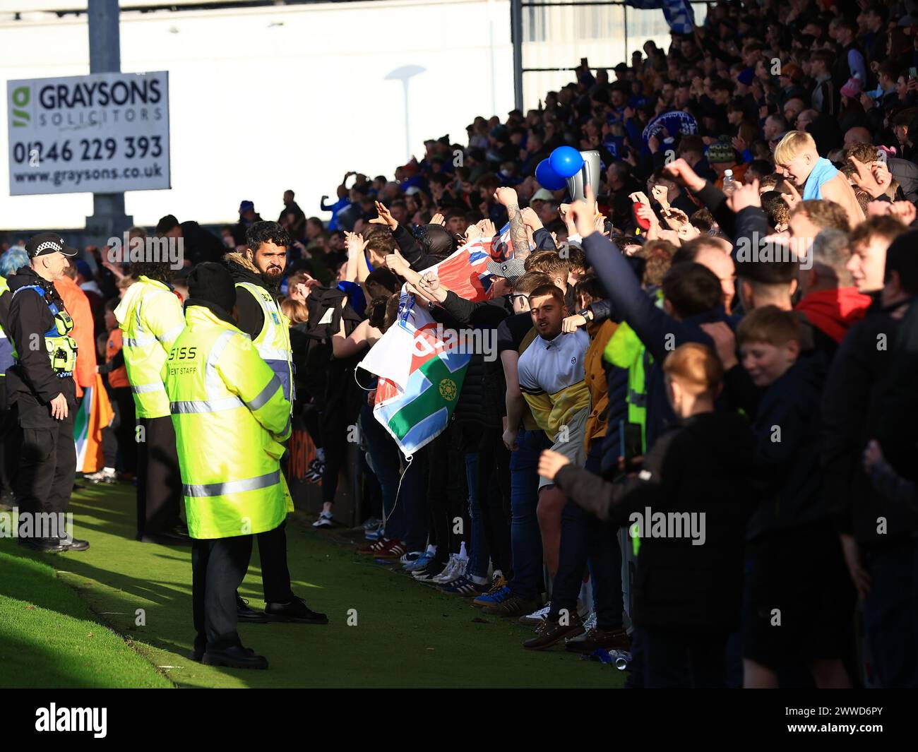 Chesterfield, UK. 23rd Mar, 2024. Chesterfield fans gather pitch side ...