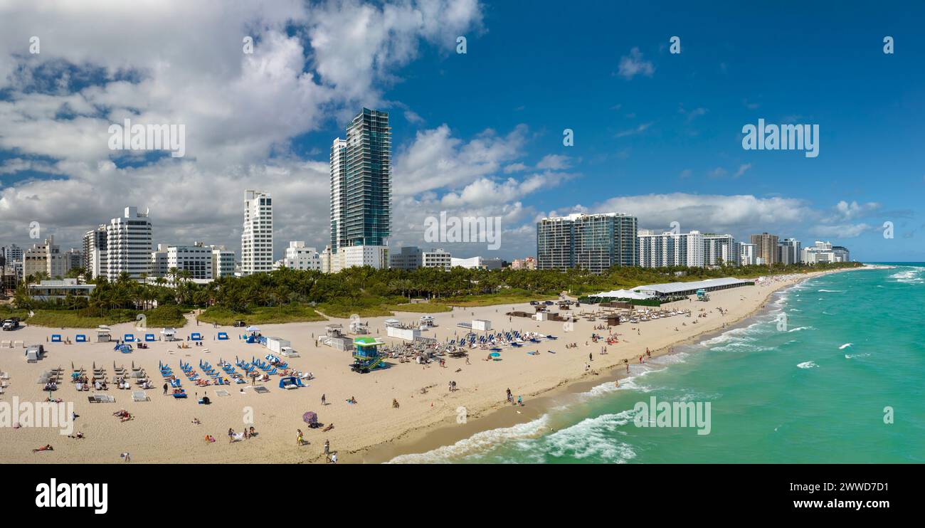 Aerial view of South Beach sandy surface with tourists relaxing on hot ...