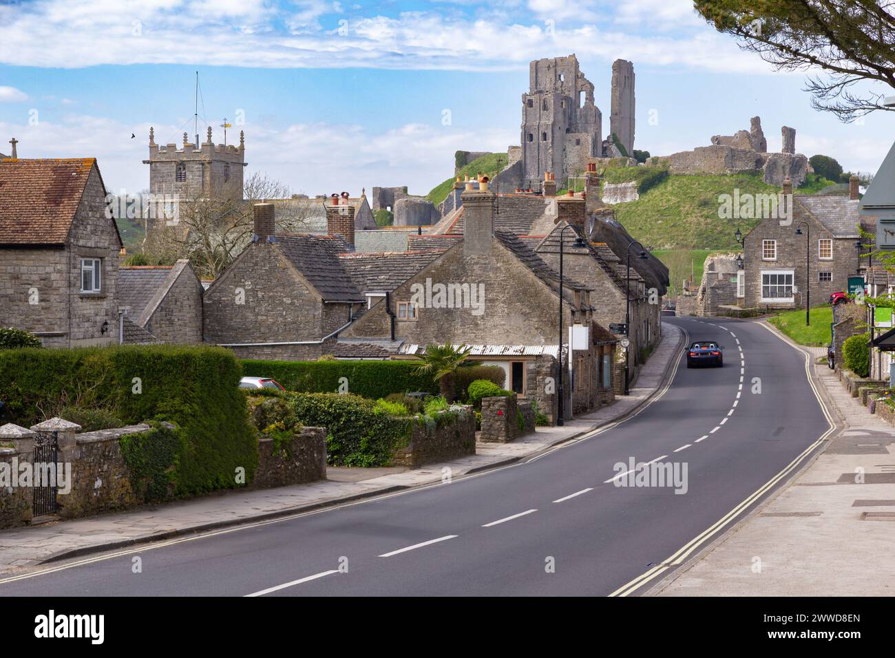 Sweeping view of Corfe village and the ruins of its prominent castle ...