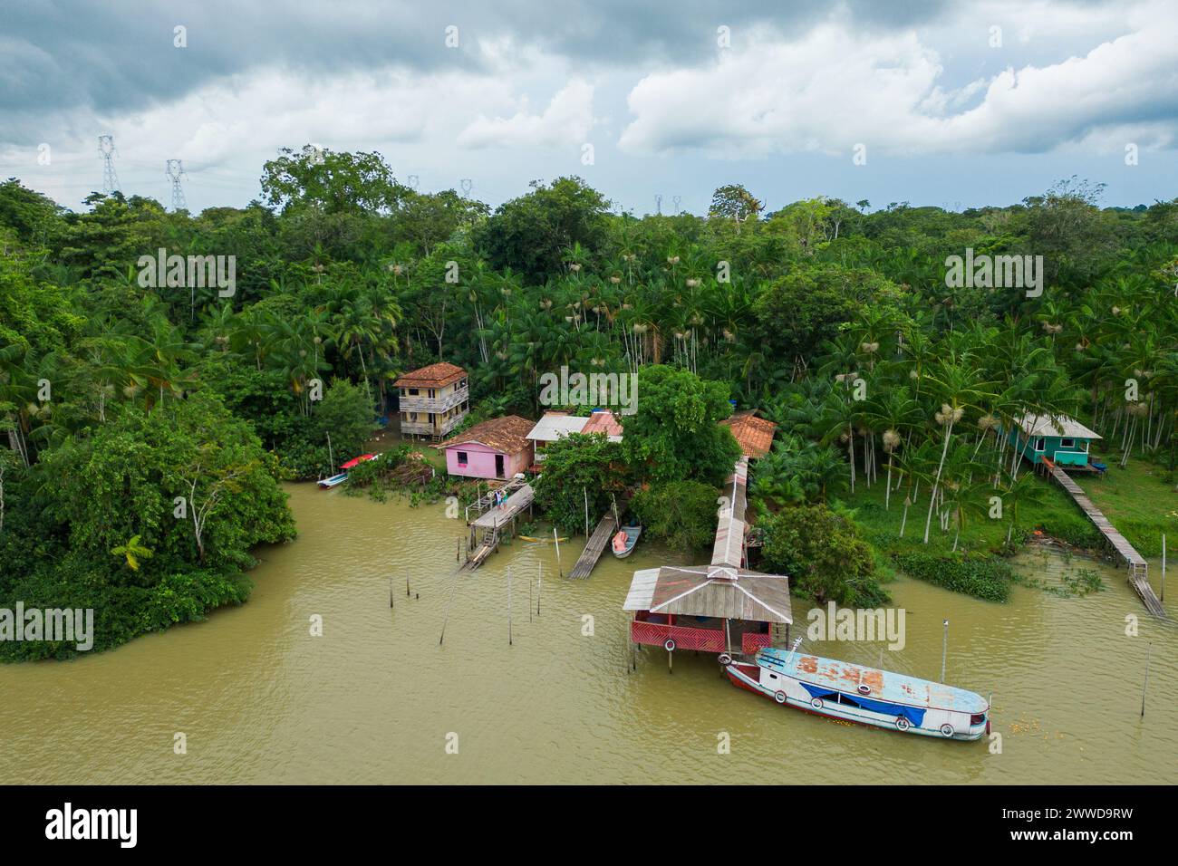 Aerial View of a Small Community Houses in Tropical Rainforest by the ...