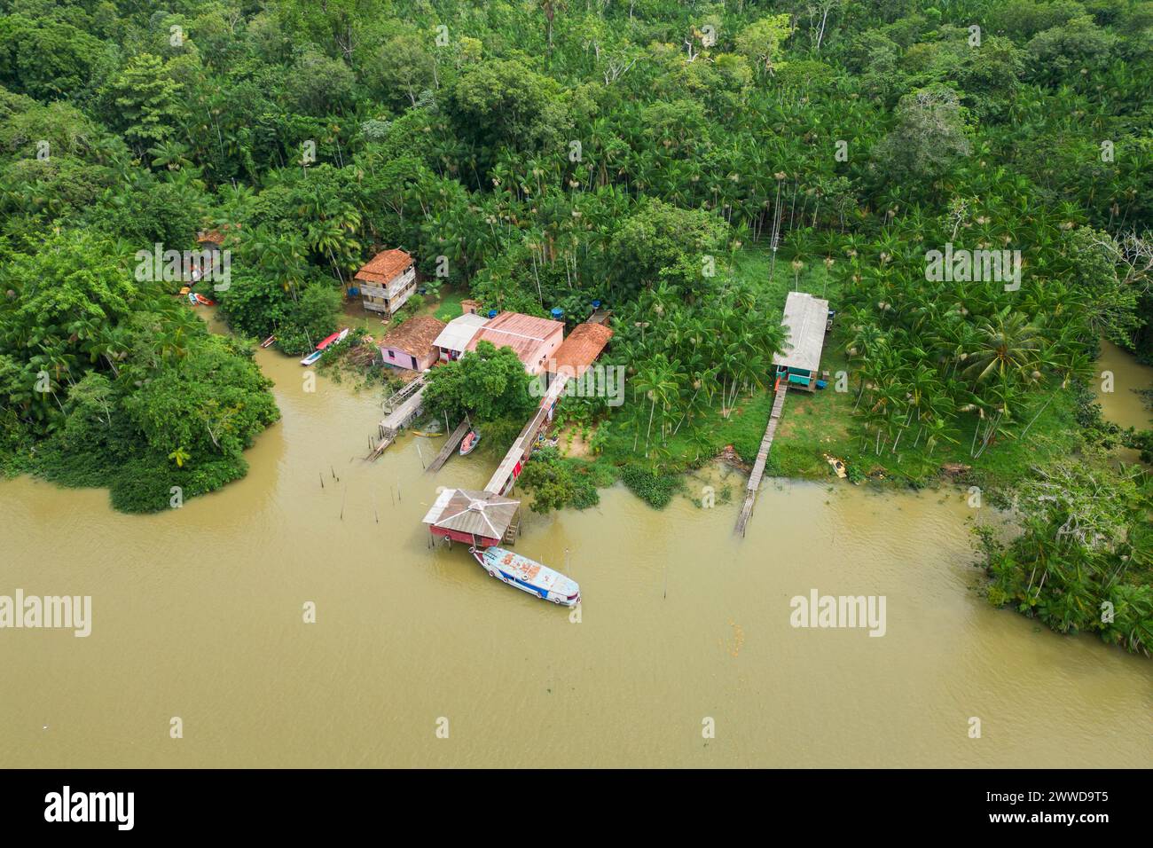 Aerial View of a Small Community Houses in Tropical Rainforest by the ...