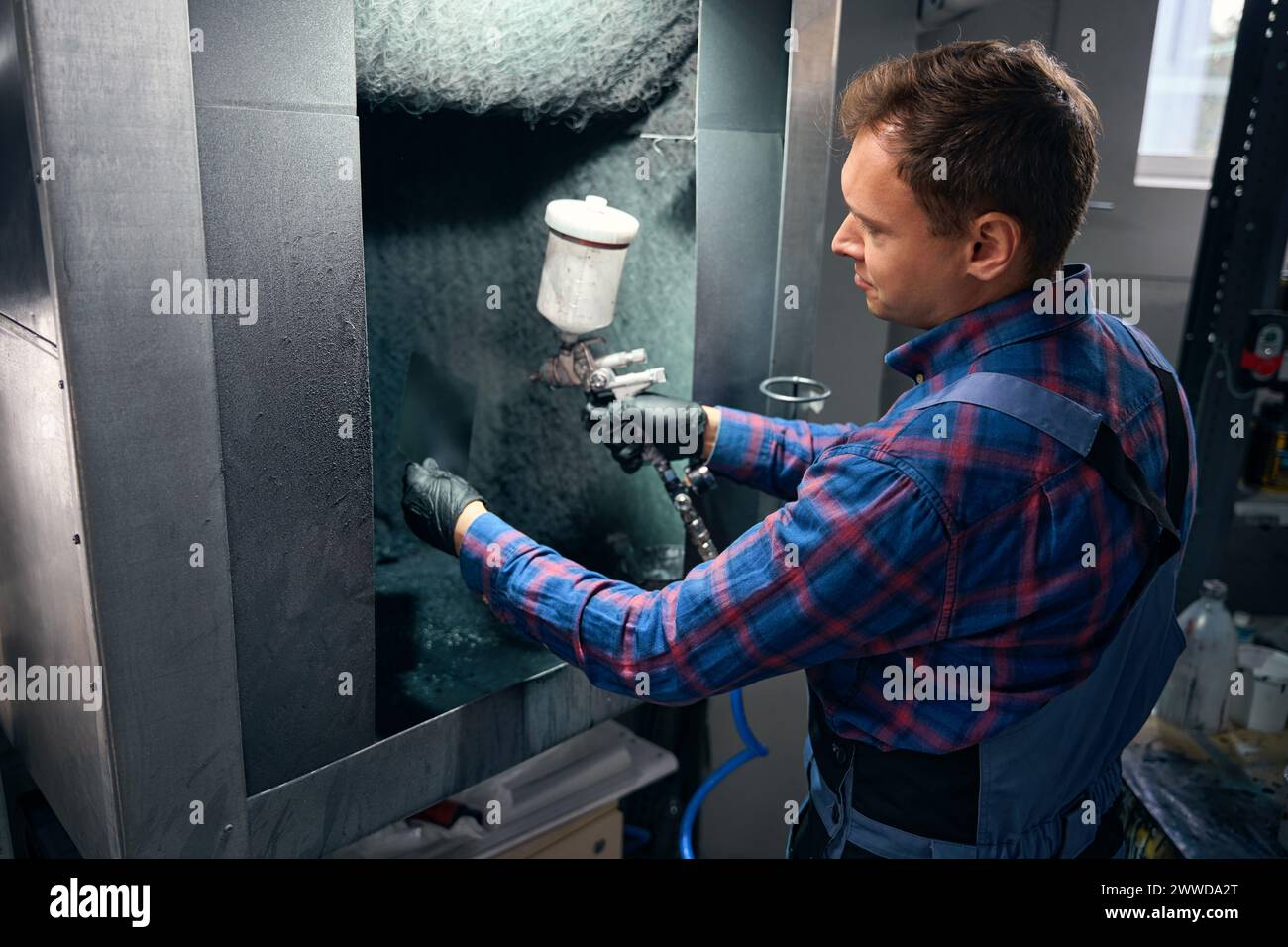 Worker selecting and mixing of colors for car painting Stock Photo - Alamy