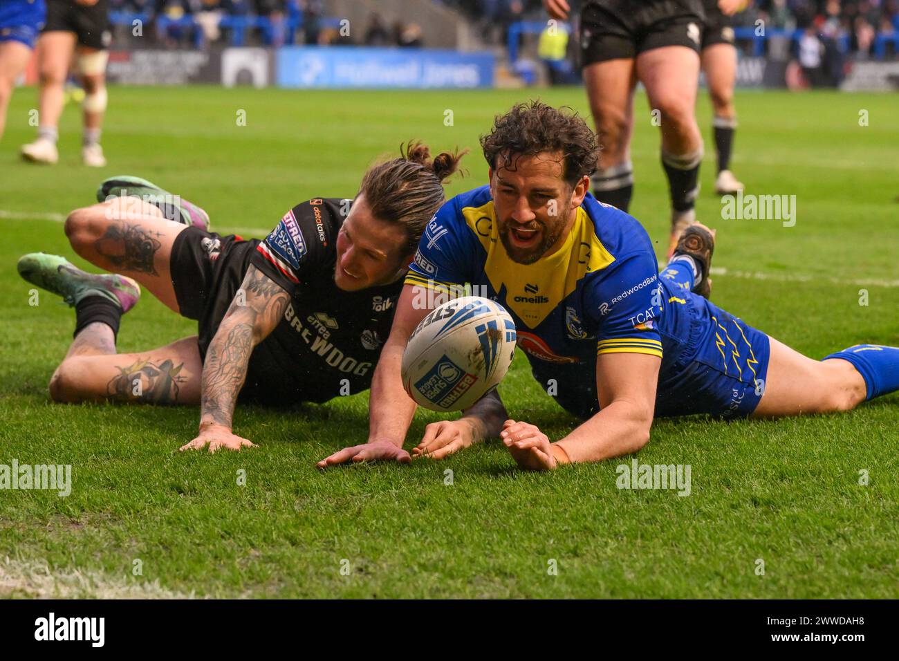 Toby King of Warrington Wolves goes over for a try during the Betfred ...