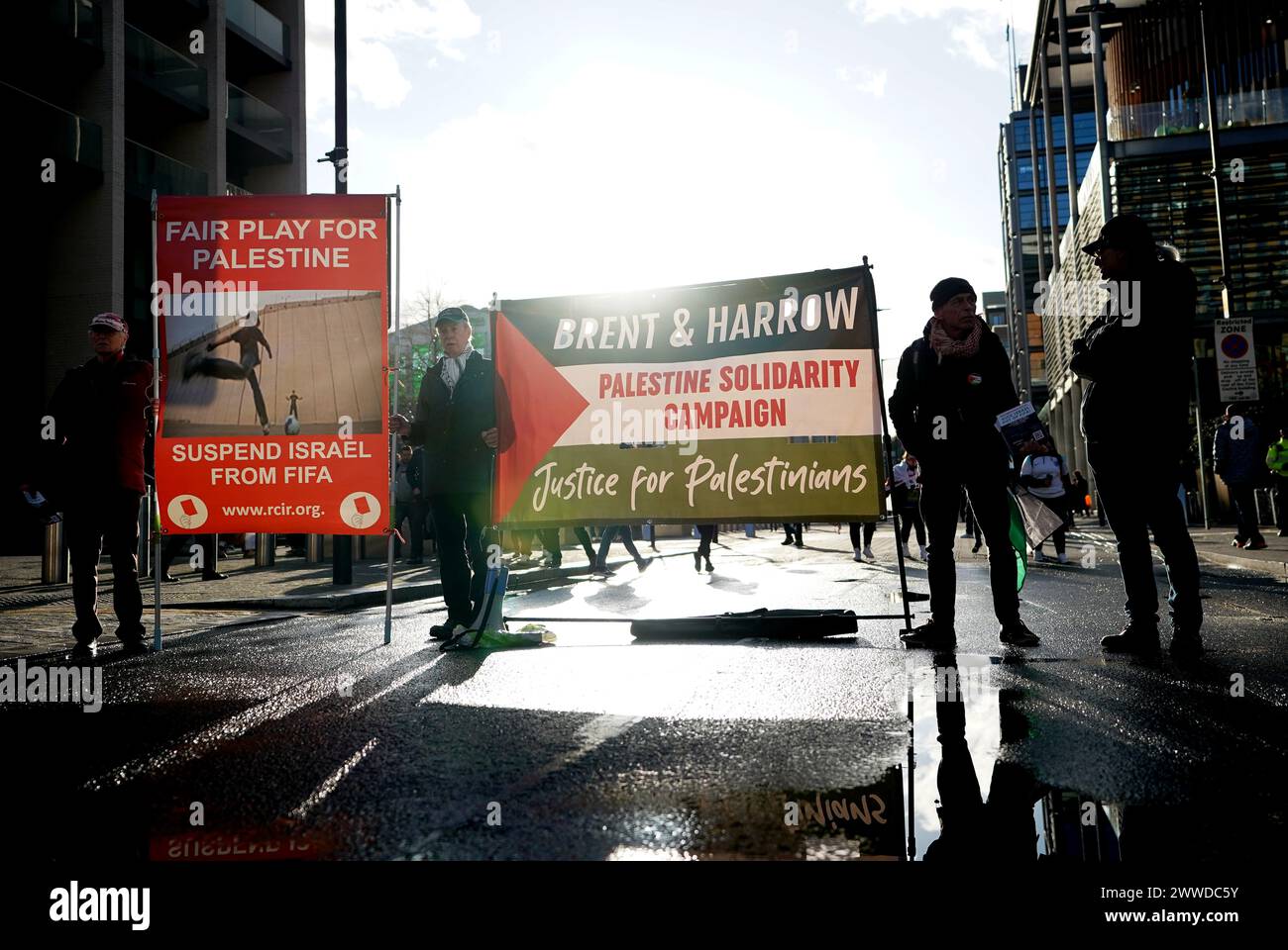 People holding flags in support of Palestine outside the stadium on ...