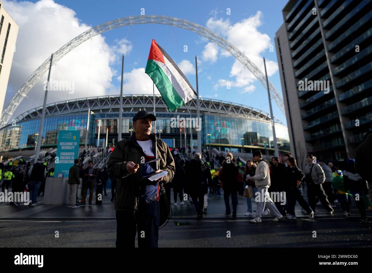 People holding flags in support of Palestine outside the stadium on ...