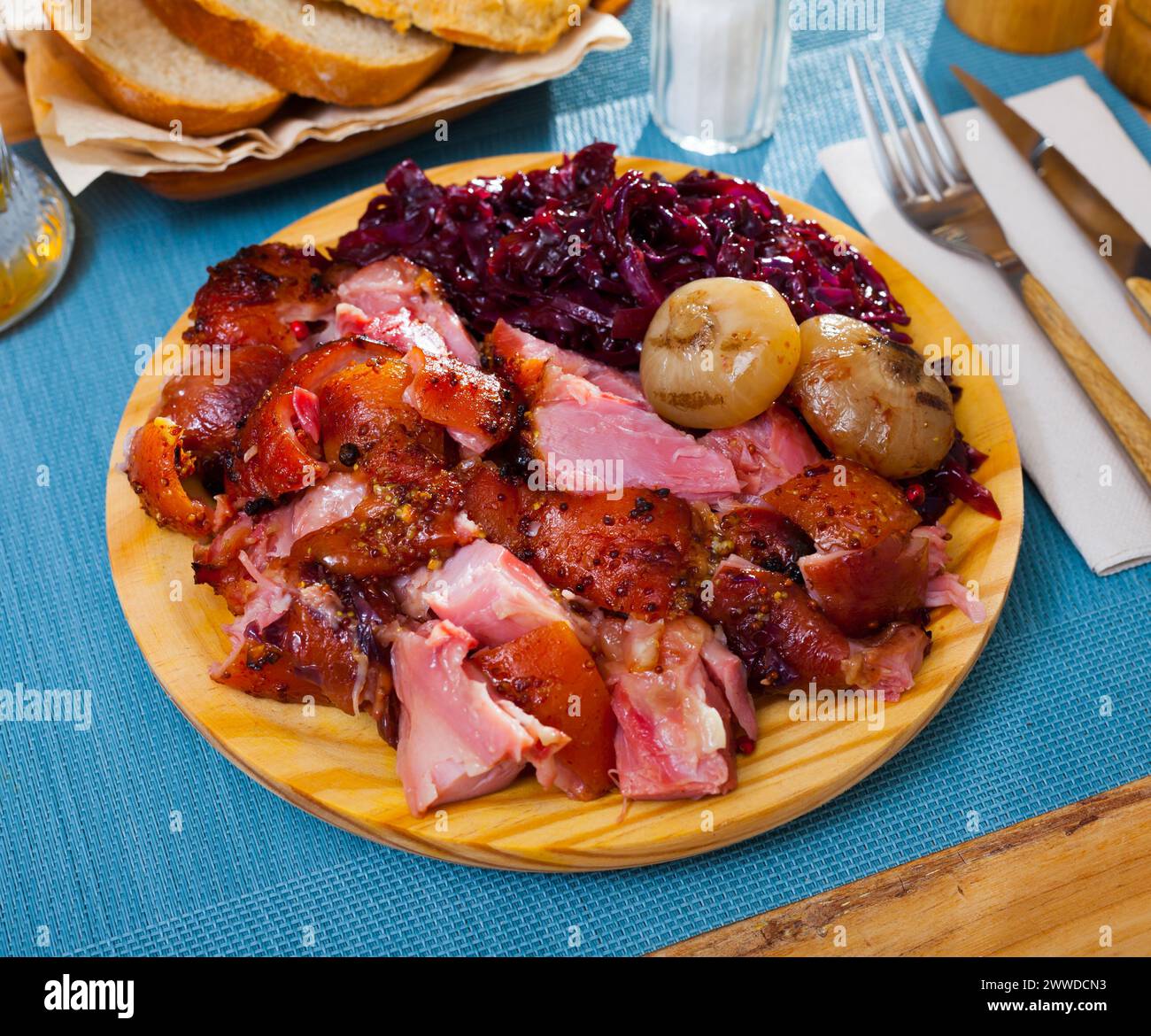 Sliced pork shank with braised cabbage Stock Photo - Alamy