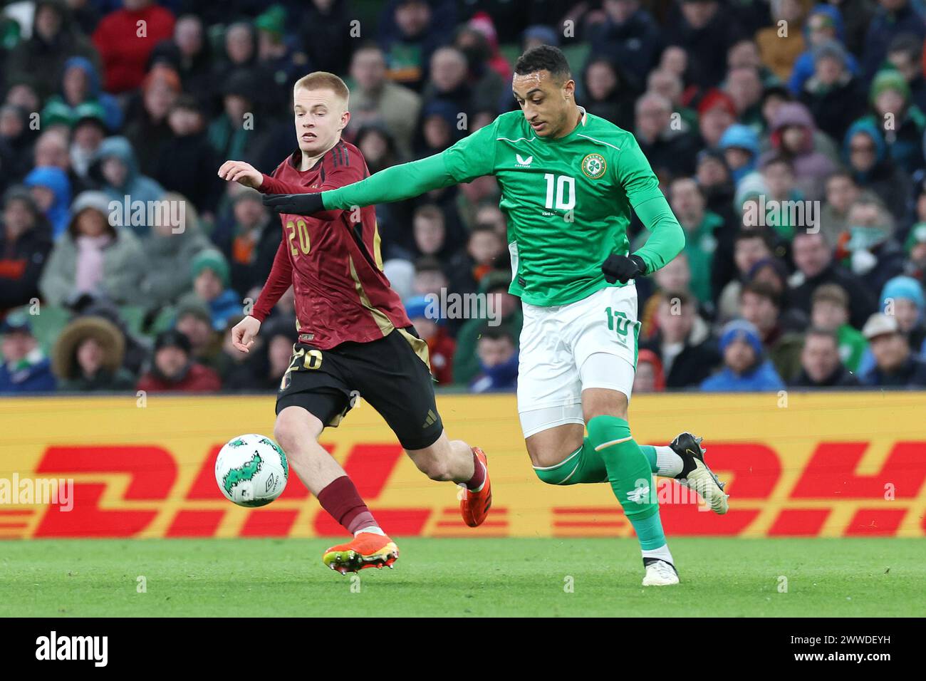 Republic of Ireland's Adam Idah (right) and Belgium’s Arthur Vermeeren battle for the ball ...