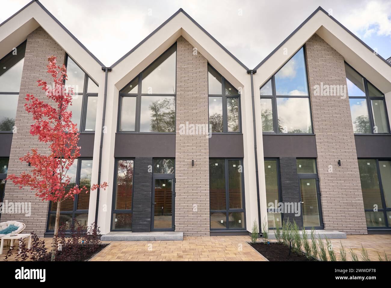 Fronts of modern houses lined up to each other Stock Photo - Alamy