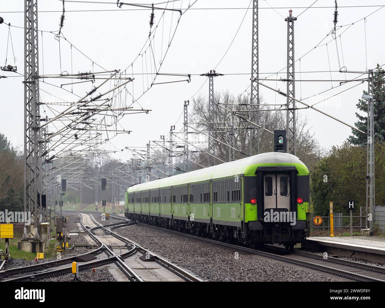 Trebbin, Germany. 22nd Mar, 2024. A Flixtrain passes Trebbin station ...